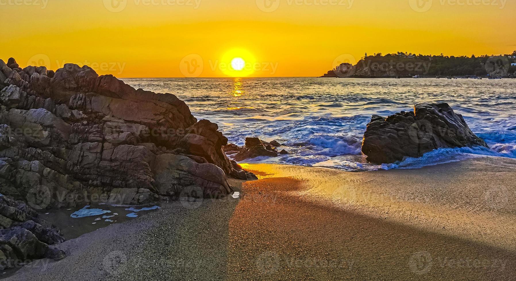 Colorful golden sunset big wave rocks beach Puerto Escondido Mexico ...