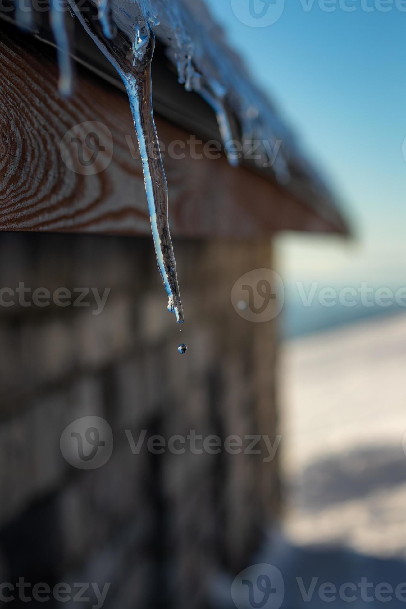 A melting icicle on a roof 20922993 Stock Photo at Vecteezy