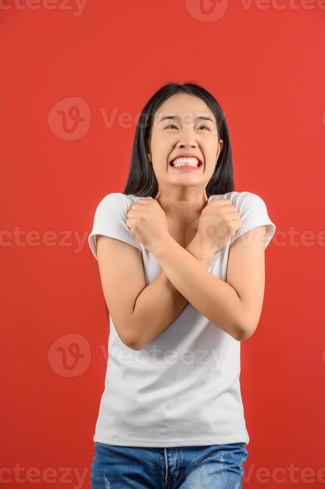 Portrait Of Young Asian Woman In White T Shirt Hugging Oneself Happy