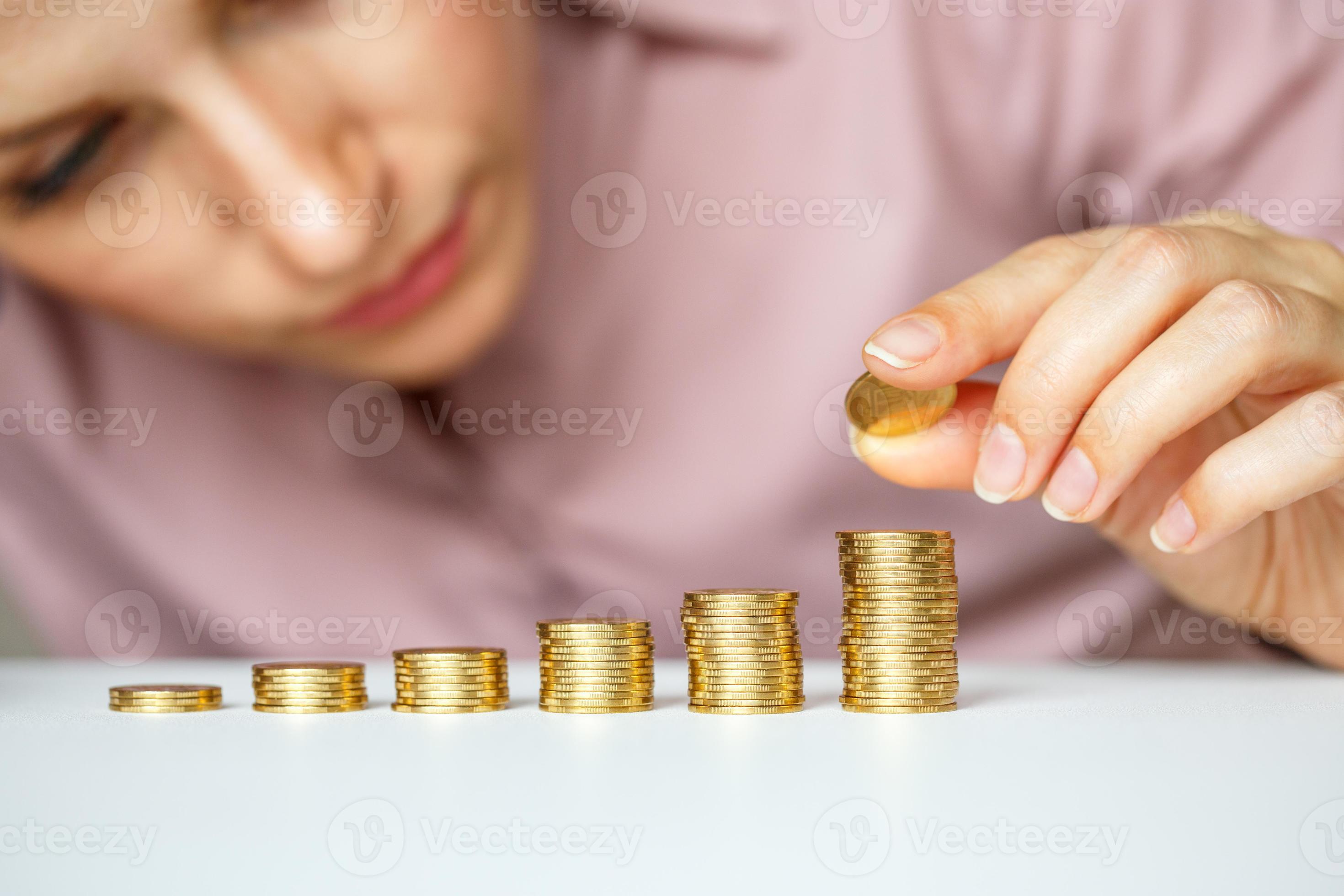Woman stacking gold coins into increasing columns 21095147 Stock Photo ... Woman stacking gold coins into increasing columns 21095147 Stock Photo ...