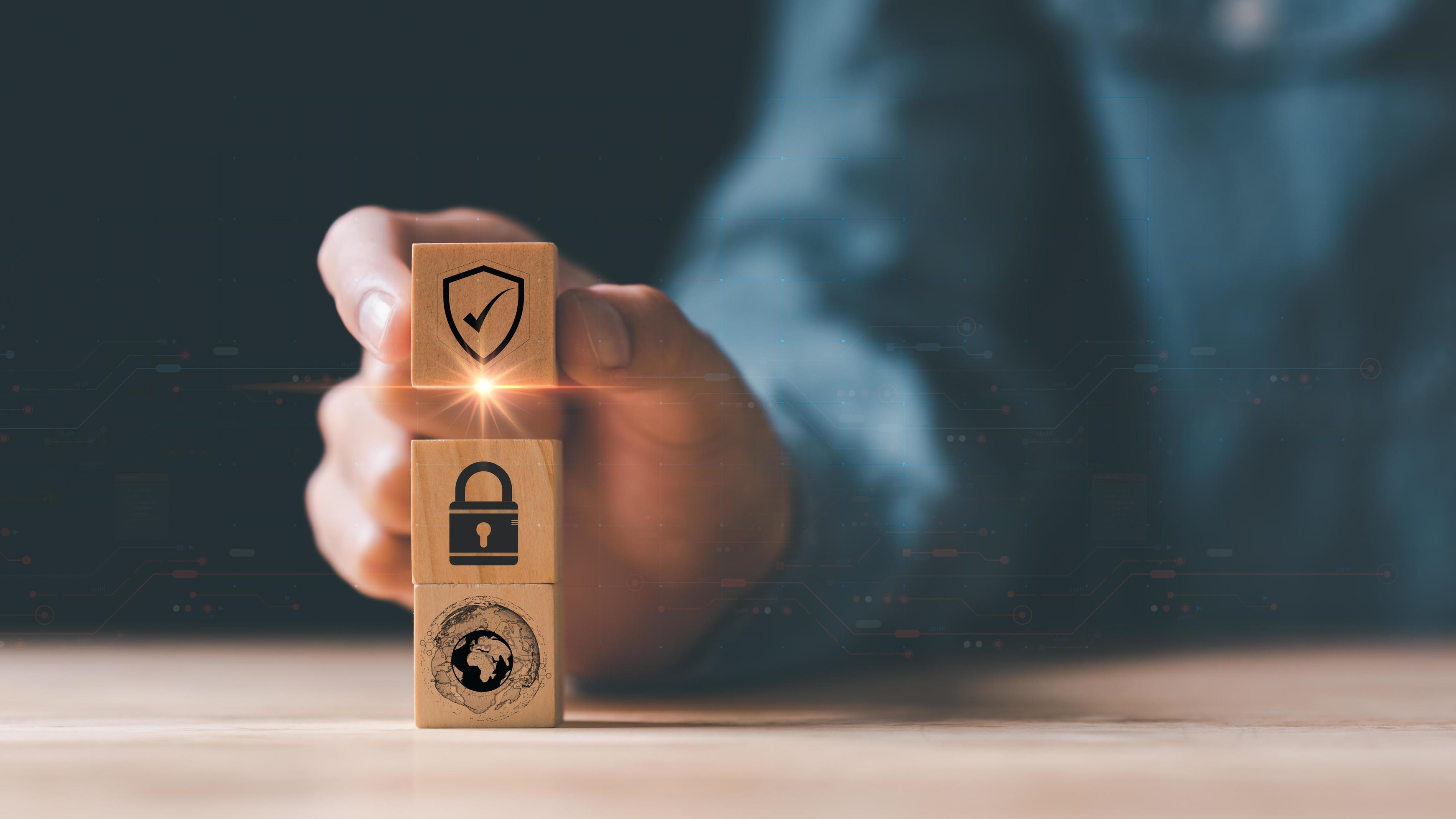 Human Hand Holding A Wooden Block Cyber Security Protection