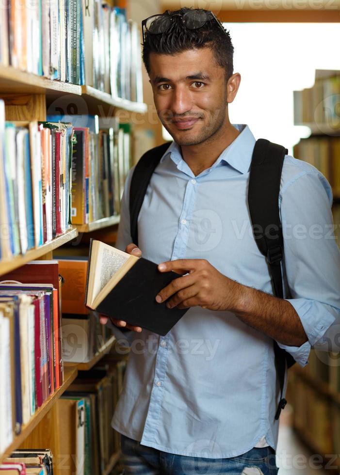 Young man in the library 21145417 Stock Photo at Vecteezy