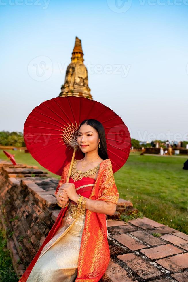 Beautiful Thai Girl In Traditional Dress Costume Red Umbrella As Thai Temple Where Is The Public