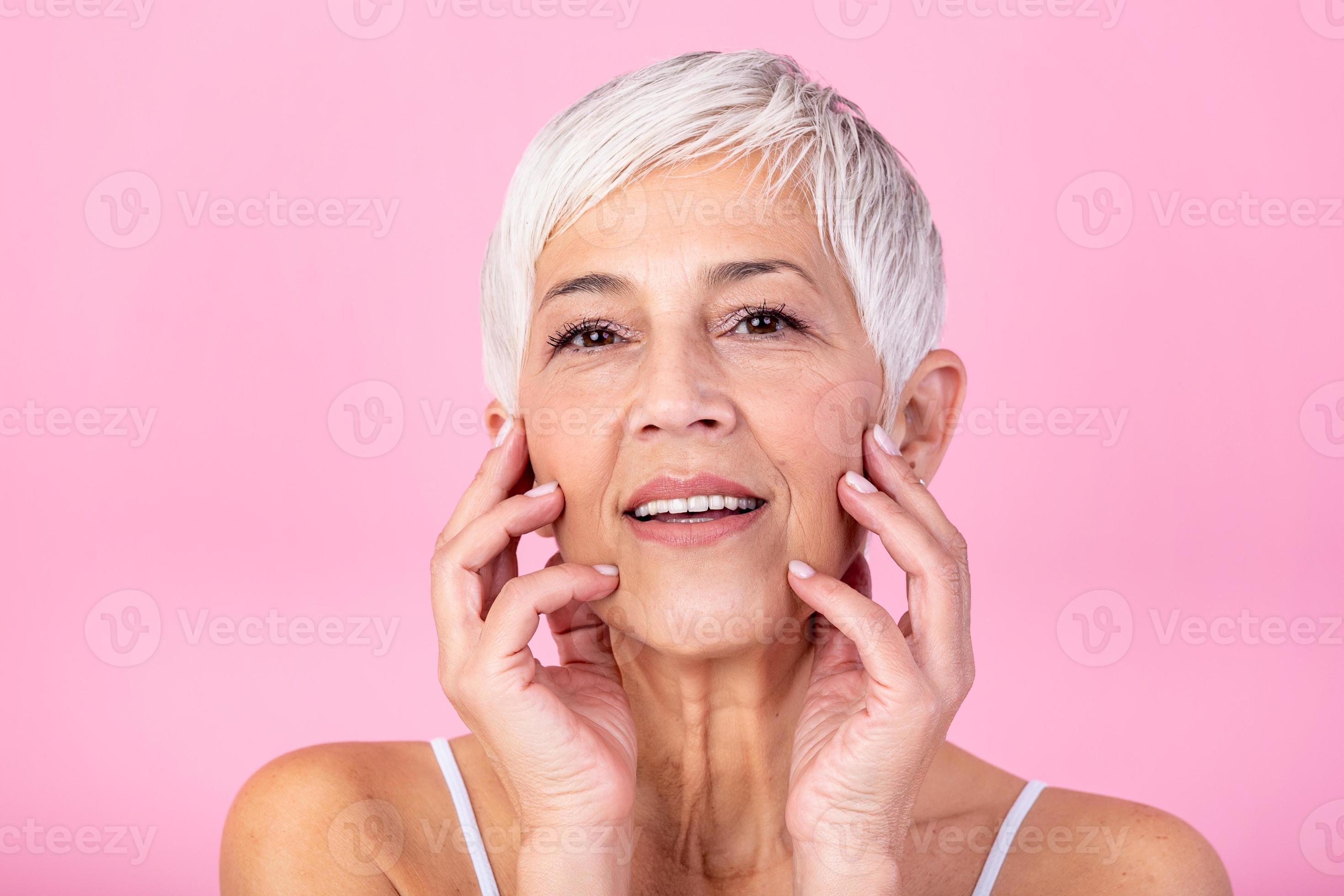 Portrait Of Beautiful Senior Woman Touching Her Perfect Skin And