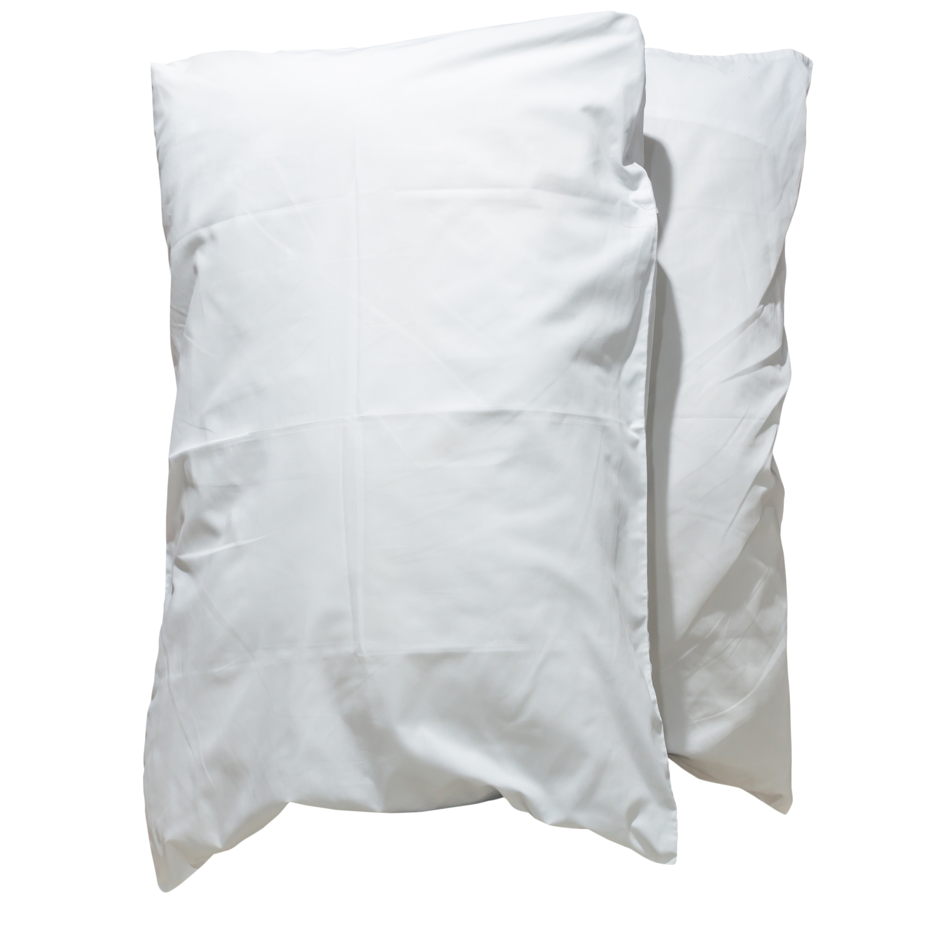 Two white pillows with cases after guest's use at hotel or resort room ... Two white pillows with cases after guest's use at hotel or resort room ...