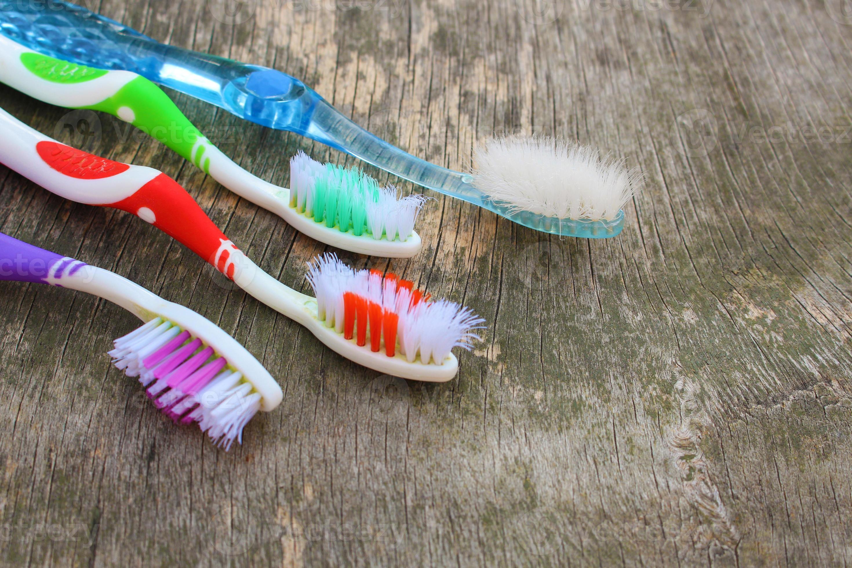 Close up of old toothbrushes on wooden background. 21480348 Stock Photo ...