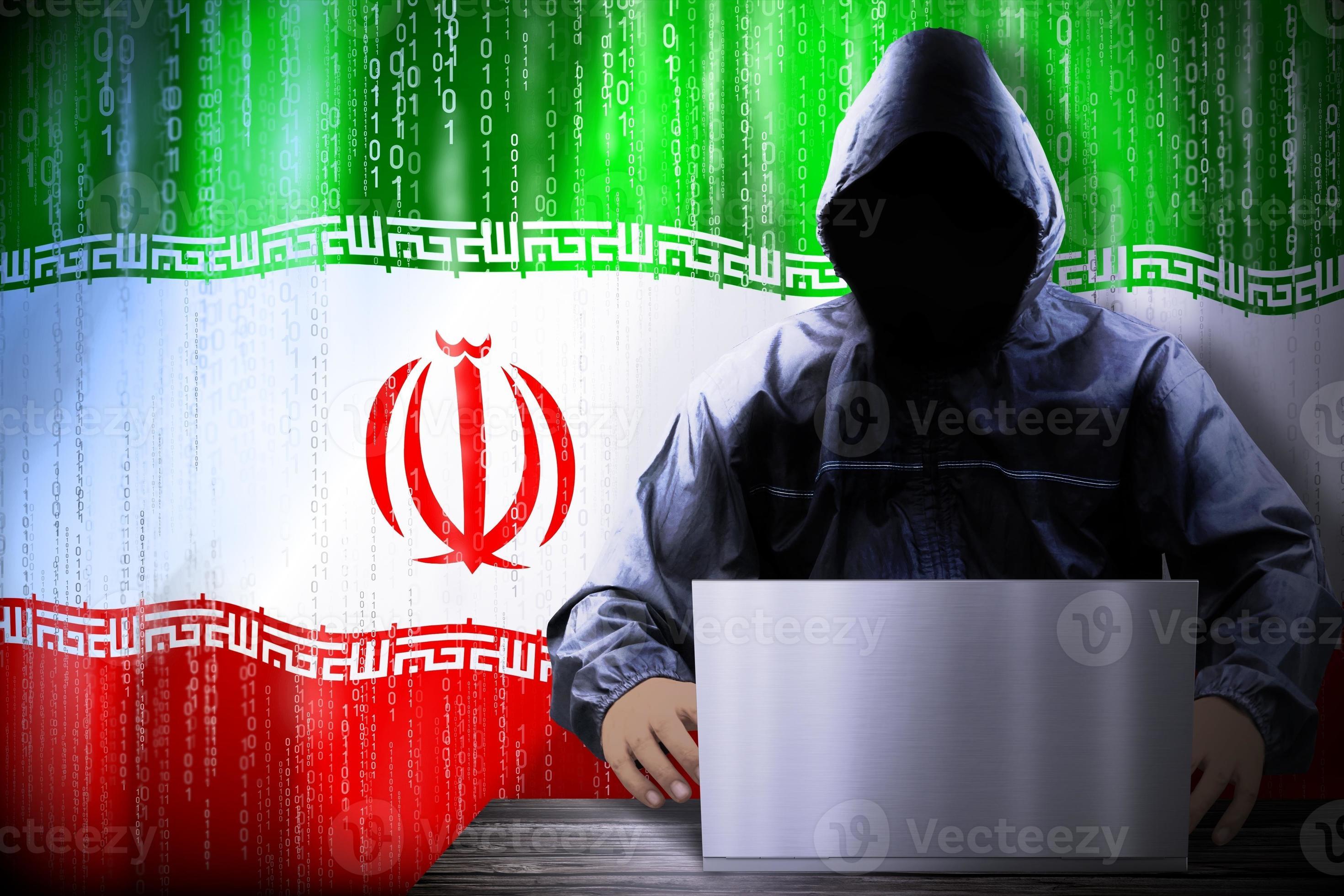 Anonymous Hooded Hacker And Flag Of Iran Binary Code Cyber Attack