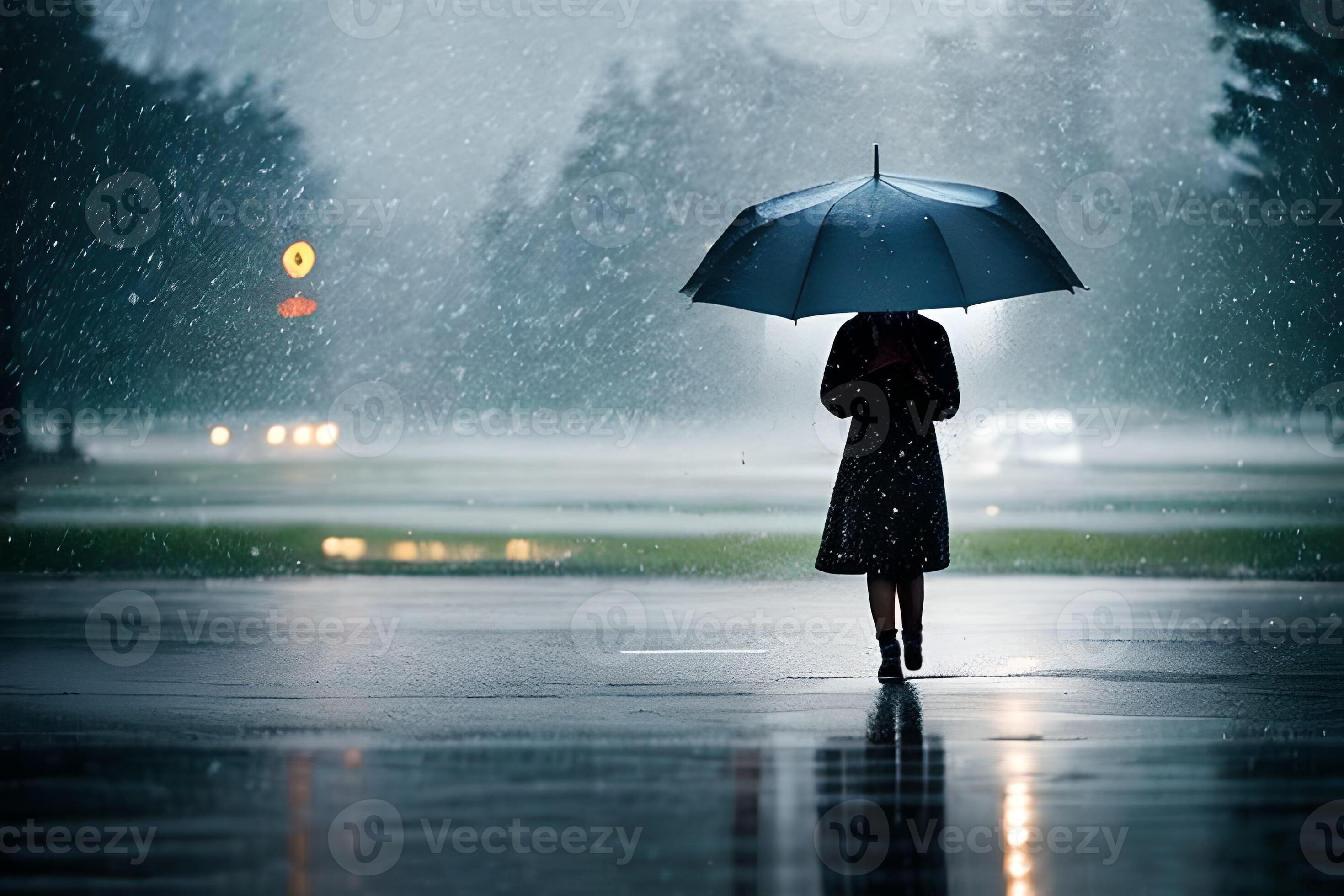 A People With An Umbrella In The Middle Of Heavy Rain At The Road