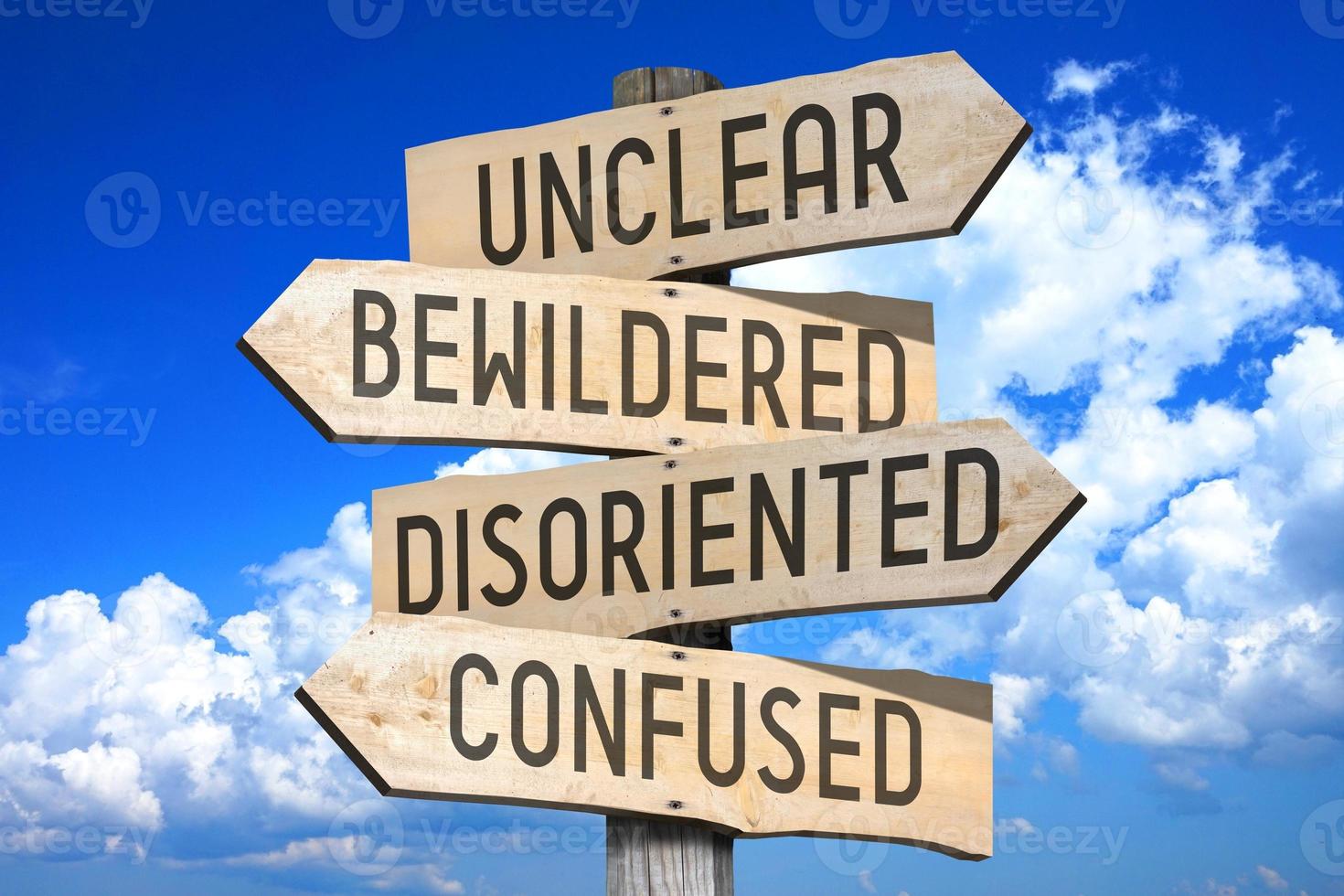 Unclear, Bewildered, Disoriented, Confused - Wooden Signpost with Four ... Unclear, Bewildered, Disoriented, Confused - Wooden Signpost with Four ...