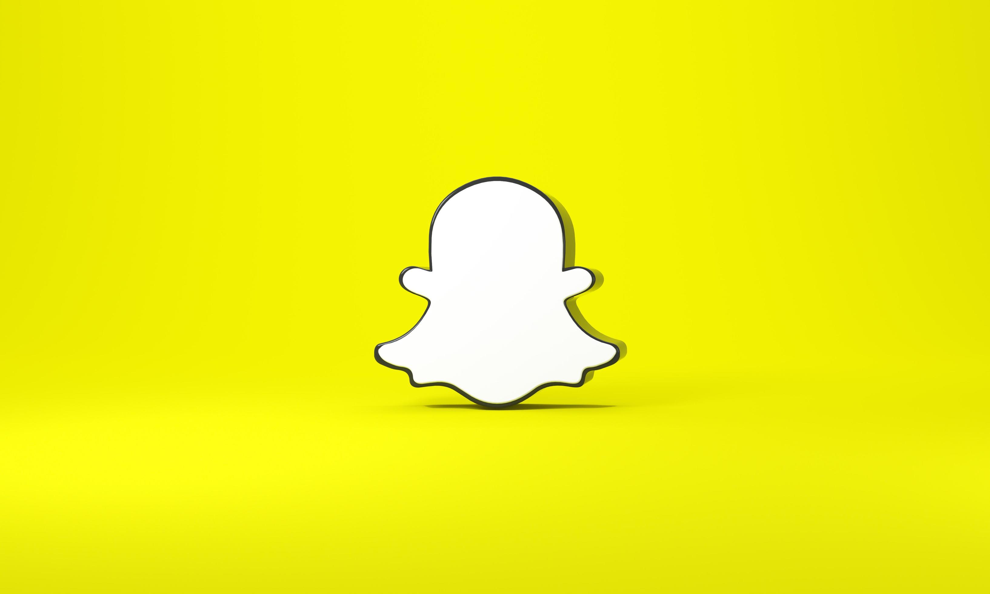Snapchat logo with space for text and graphics. Yellow background. Madrid, Spain, 2022 21636765 ...