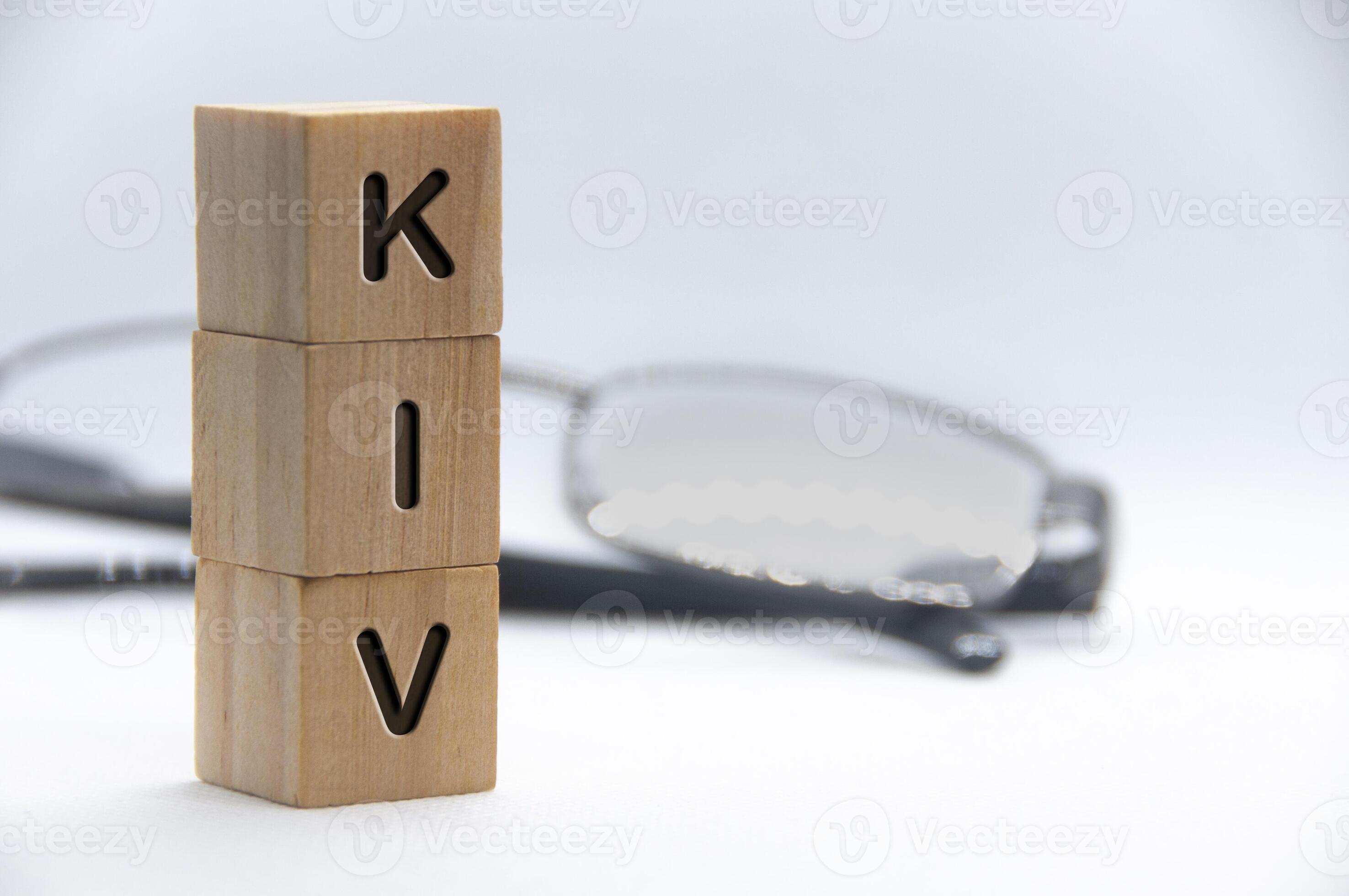 KIV text engraved on wooden blocks with white cover background. Keep in view concept. Copy space ...
