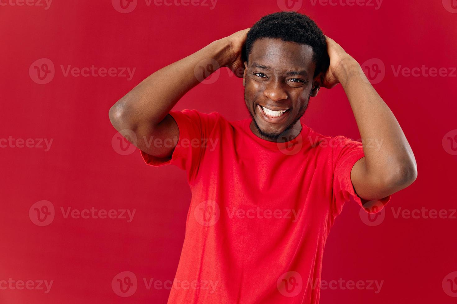 Cheerful Man Of African Appearance Holding His Head Isolated Background