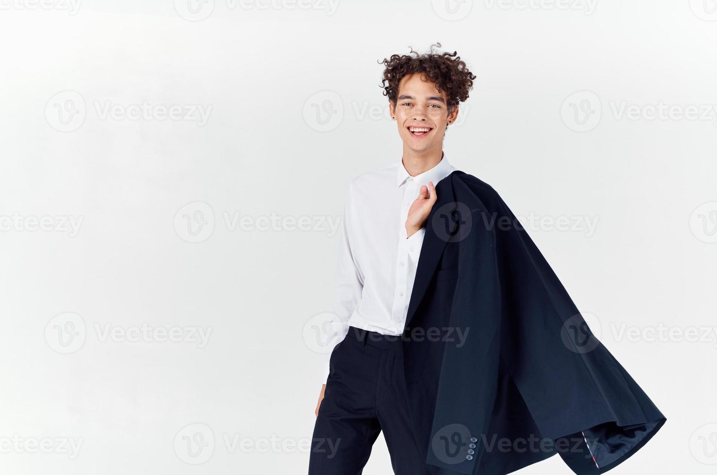 Cheerful man with curly hair in a business suit fashion modern style ...