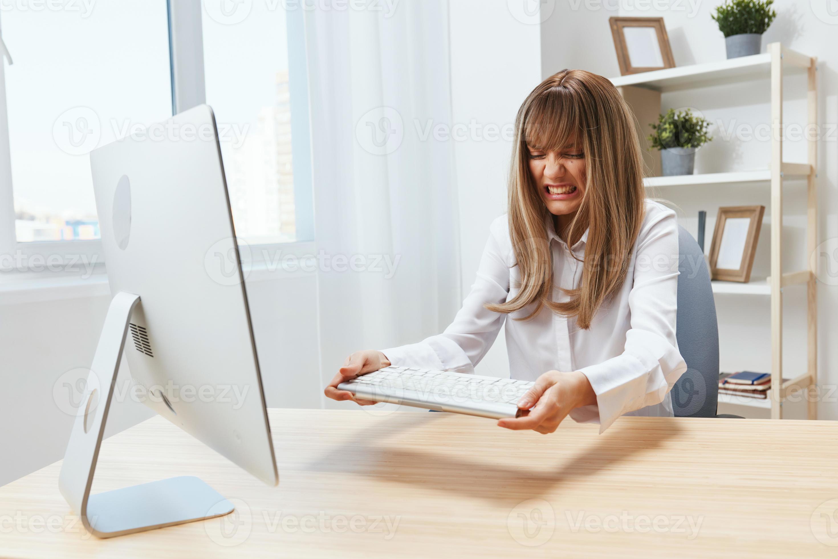 Irritated Blonde Businesswoman Screaming To Keyboard Raging After Computer Software Crash Error