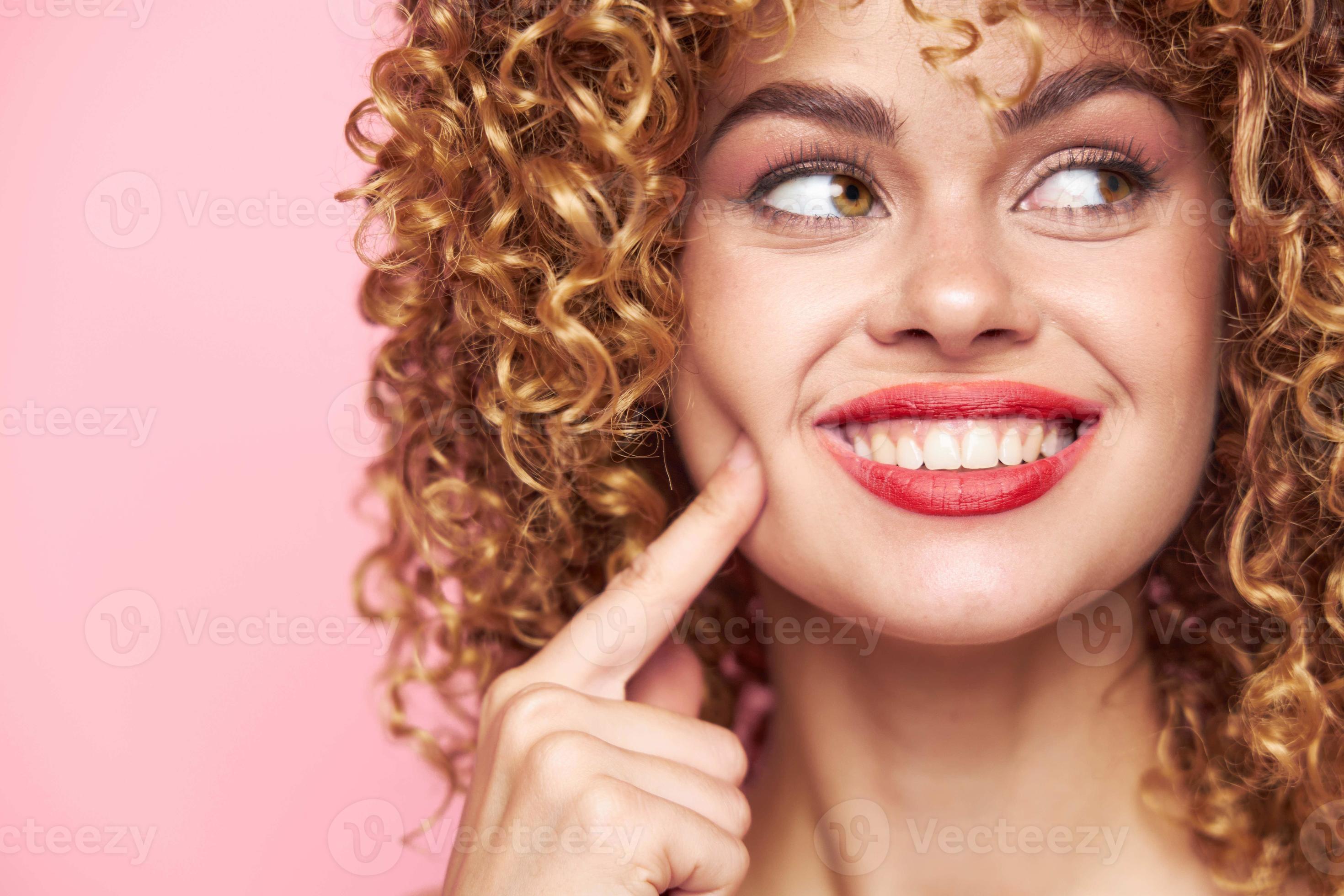Beautiful Woman Touches Her Cheek With Her Finger And Laughs Curly Hair