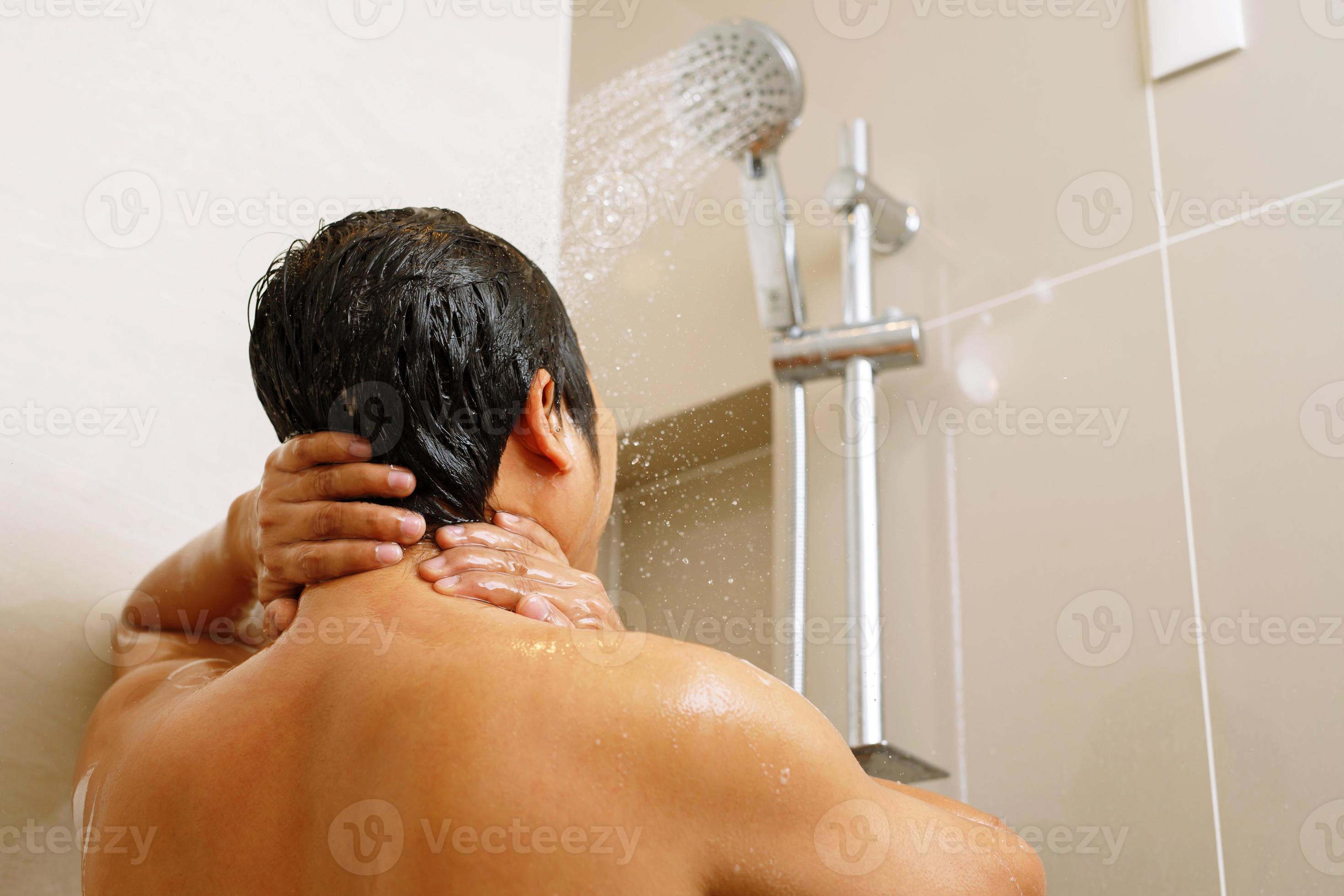A man is taking shower in bathroom at home 22149703 Stock Photo at Vecteezy