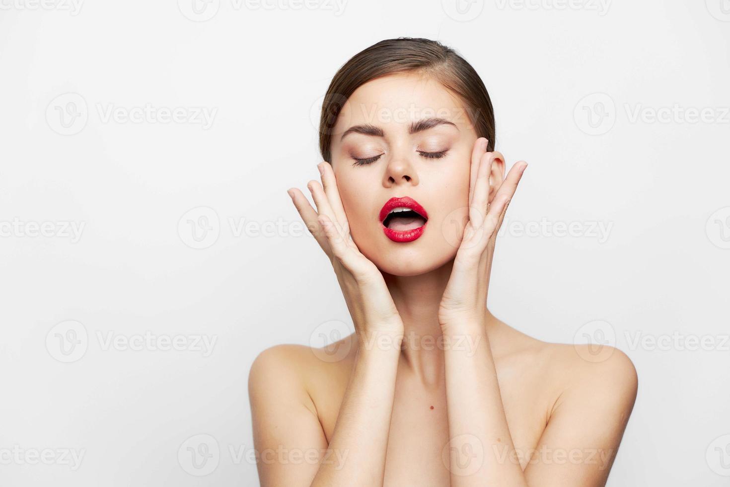 Brunette With Bare Shoulders Closed Eyes Keeps Hands On Face Open Mouth Lipstick 22316525 Stock