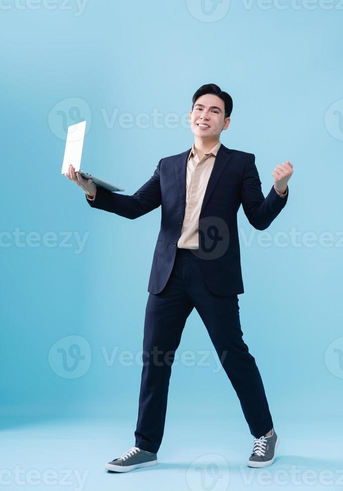 Photo of young Asian businessman on background 22495070 Stock Photo at ...