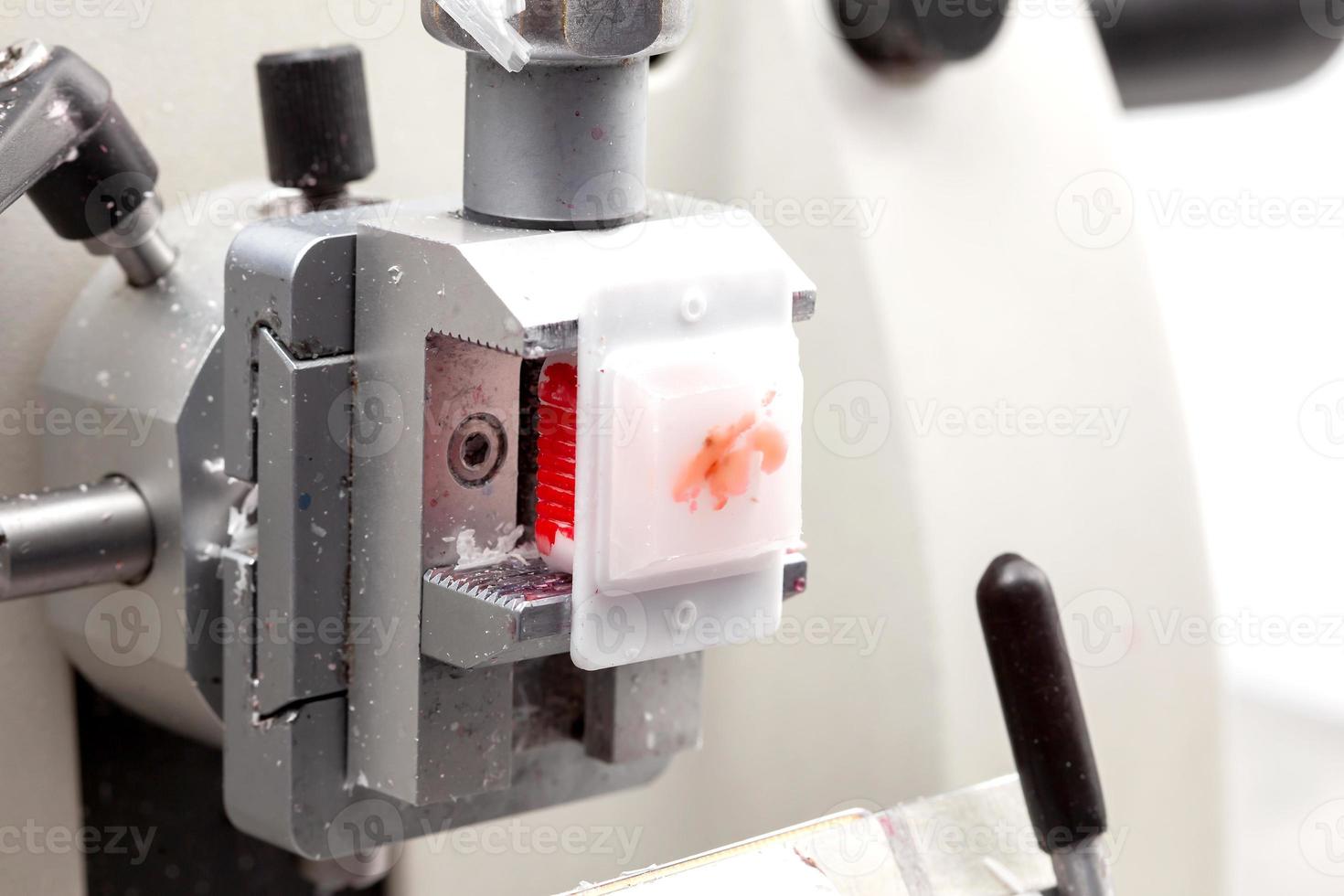 Paraffin-embedded specimen on a rotary microtome ready to be cut to obtain sections for ...