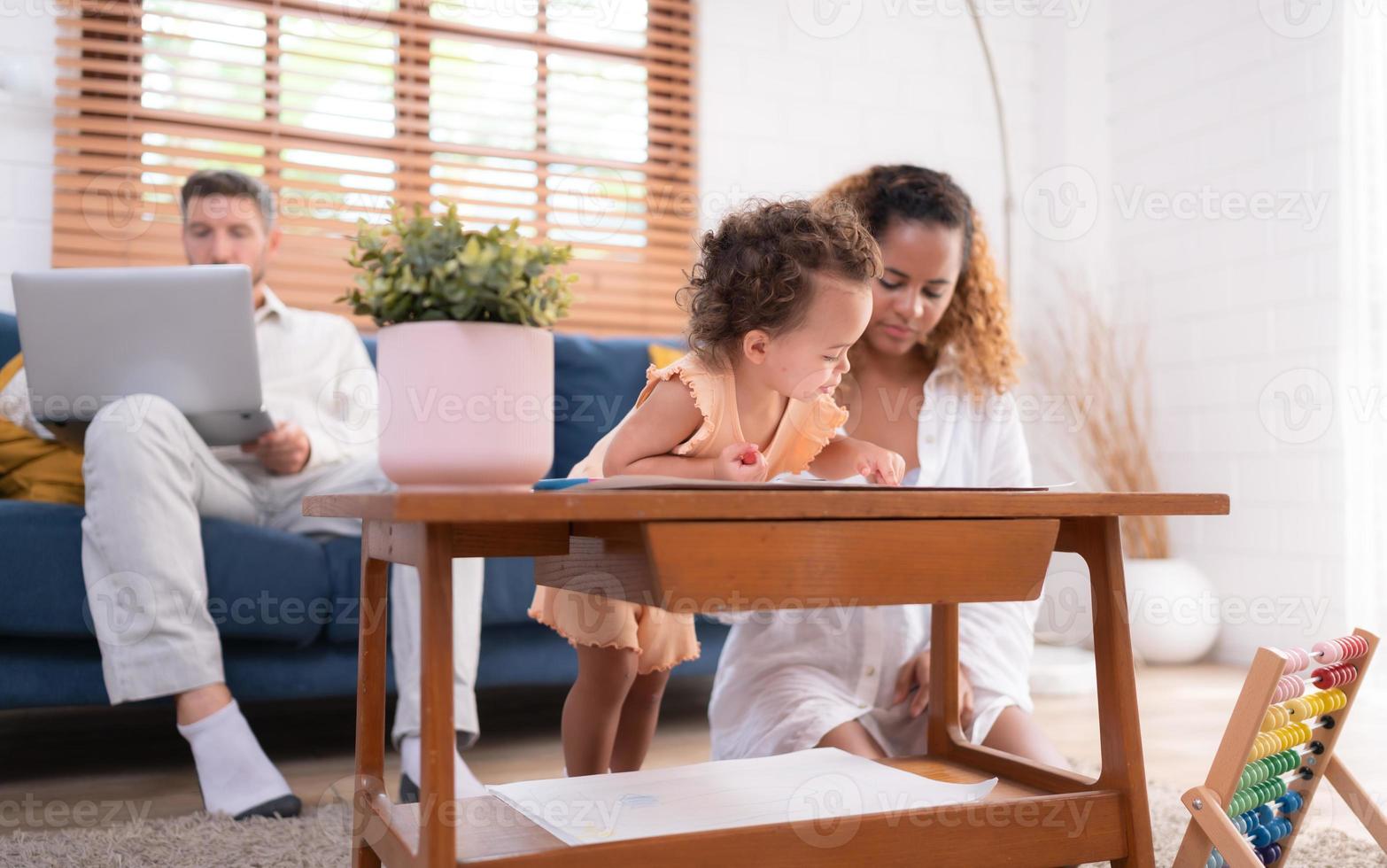 A little child's imagination is represented through colored pencil drawings, with the parents ...