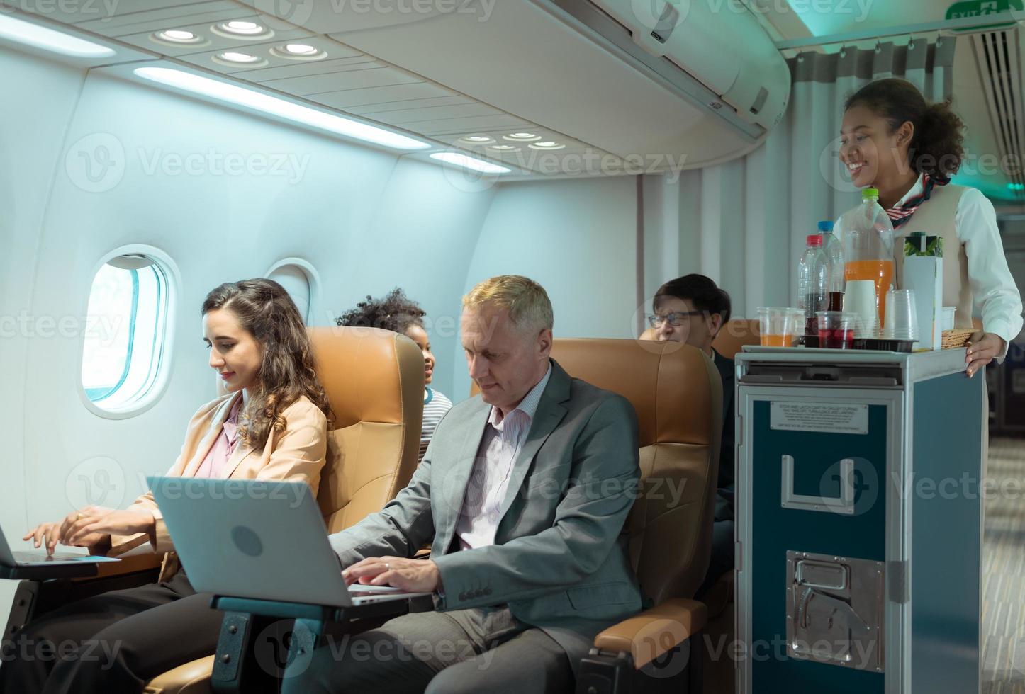 Flight attendant serving food and drinks to passengers 22956391 Stock ... Flight attendant serving food and drinks to passengers 22956391 Stock ...