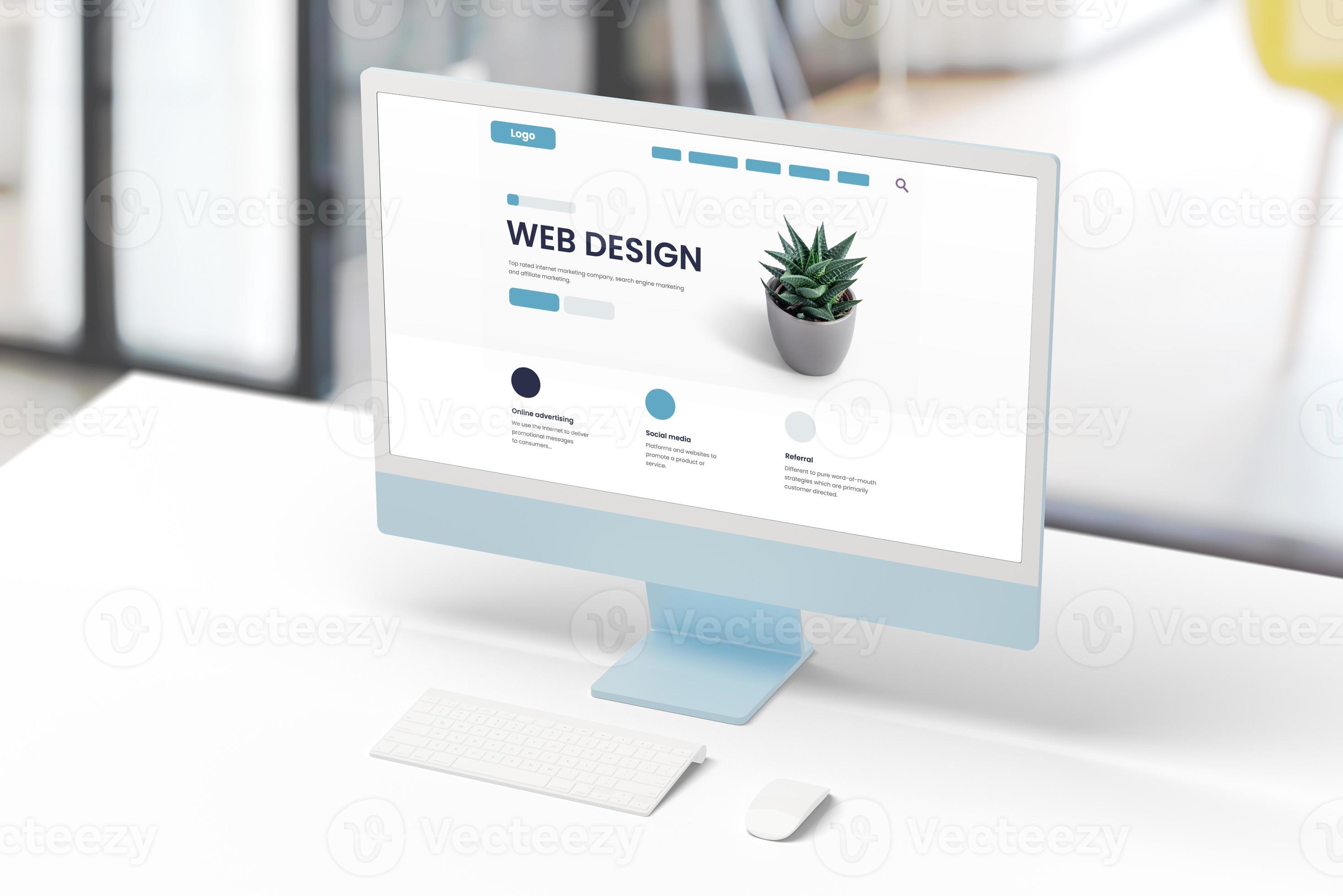 Modern computer display on an office desk with a web design studio concept page. Web design ...