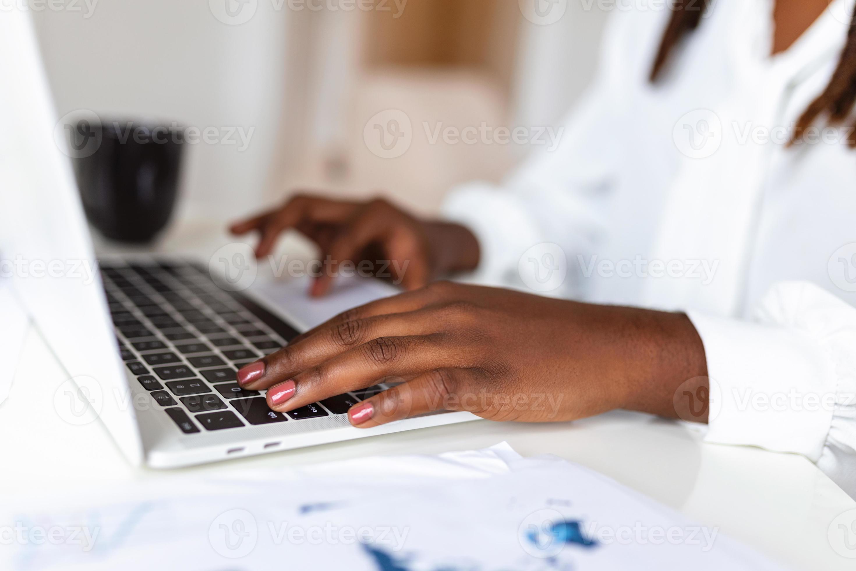 Close up image of woman hands typing on laptop computer keyboard and ...
