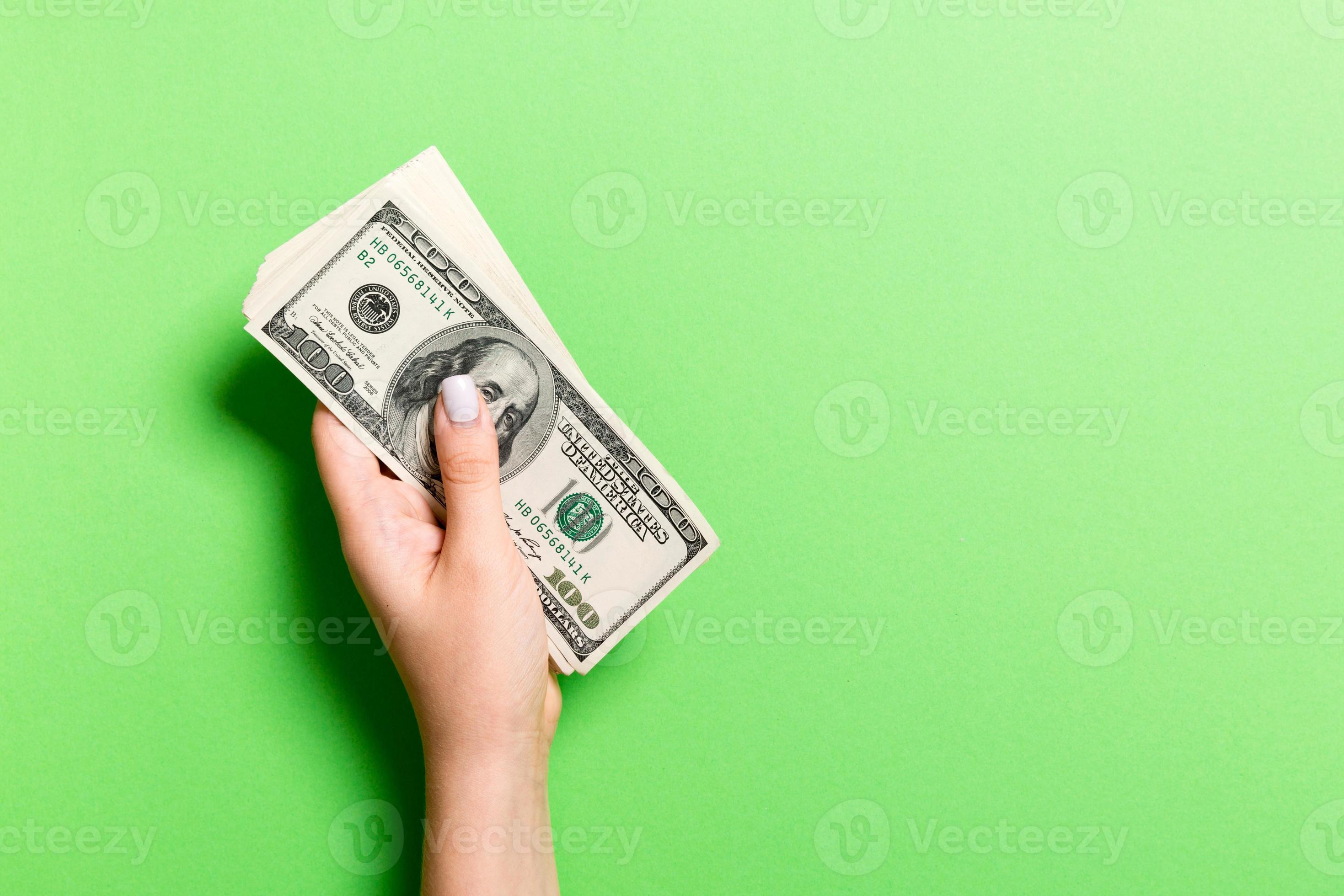 Pack Of One Hundred Dollar Bills In Femle Hands With Copy Space Top pack-of-one-hundred-dollar-bills-in-femle-hands-with-copy-space-top