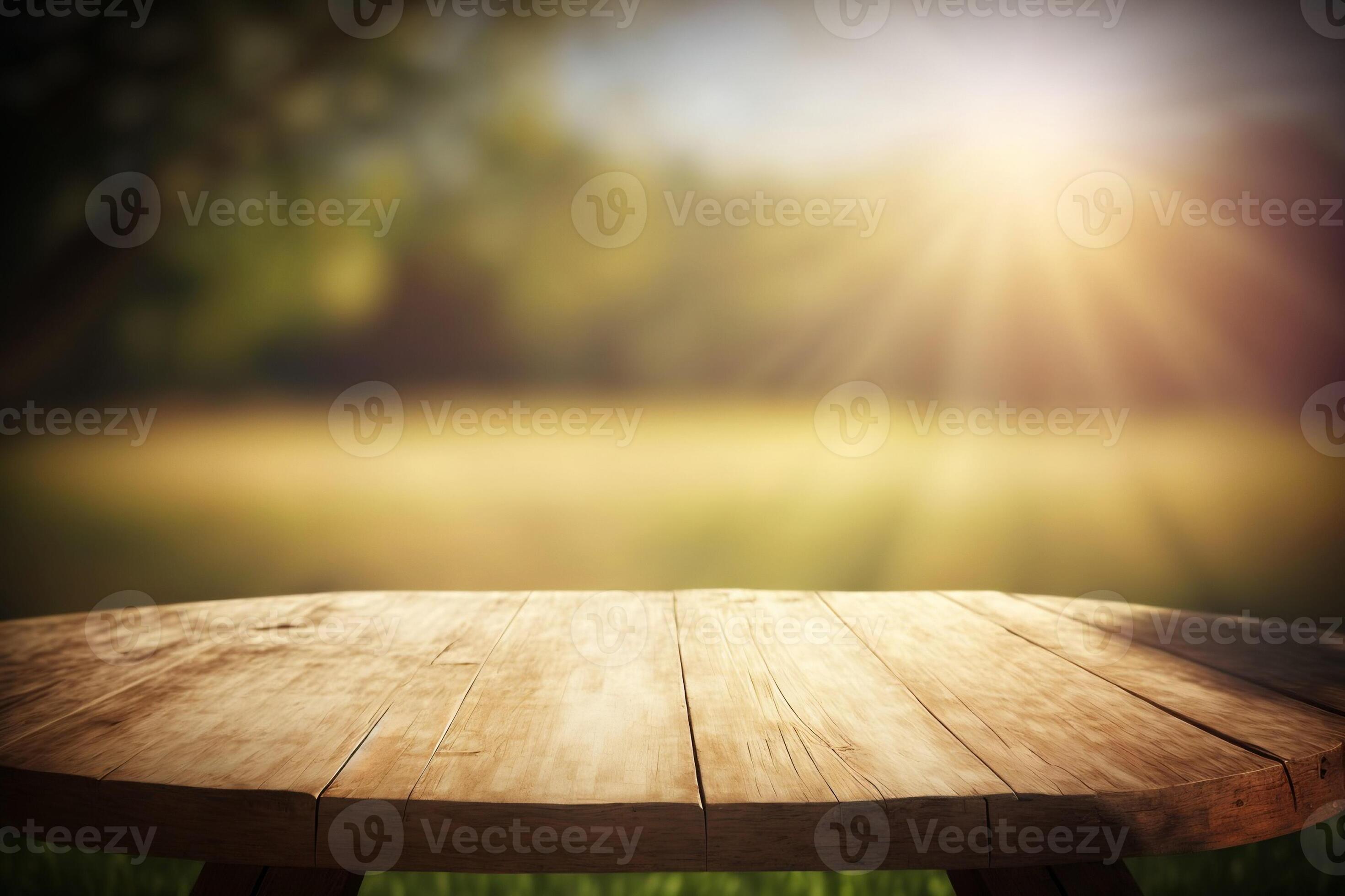 Empty wooden round table for product display with blurred garden ...