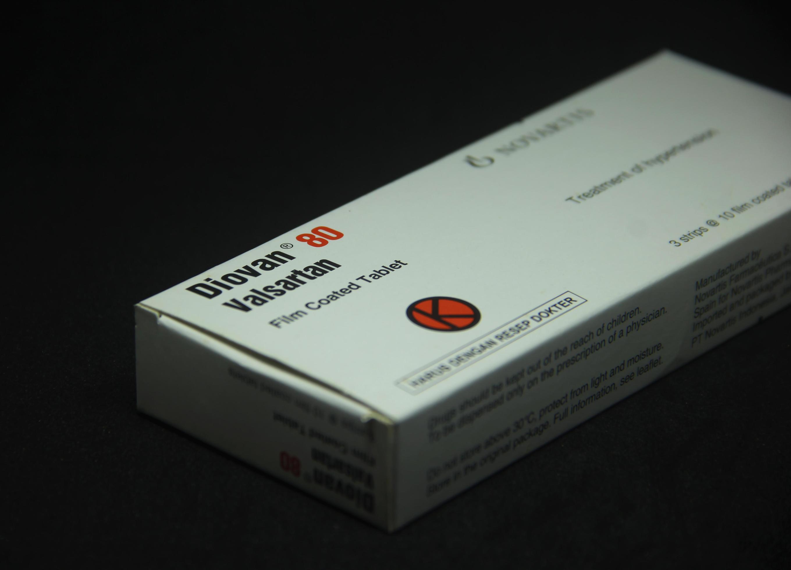 Jakarta, Indonesia - April 21th, 2023 - Novartis film coated medicine tablet diovan 80 mg white ...