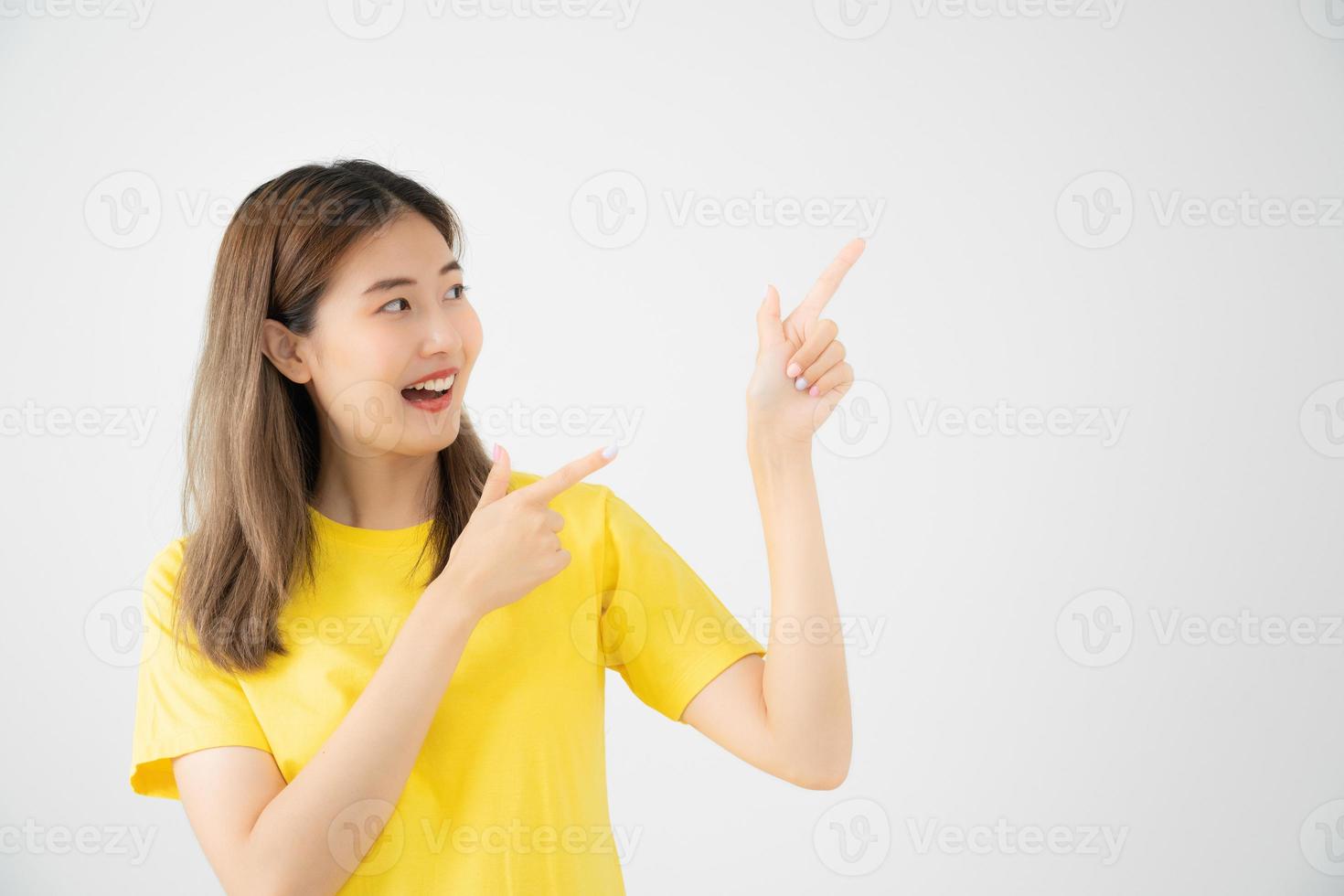 Portrait asian beautiful girl pointing blank space isolated background ...