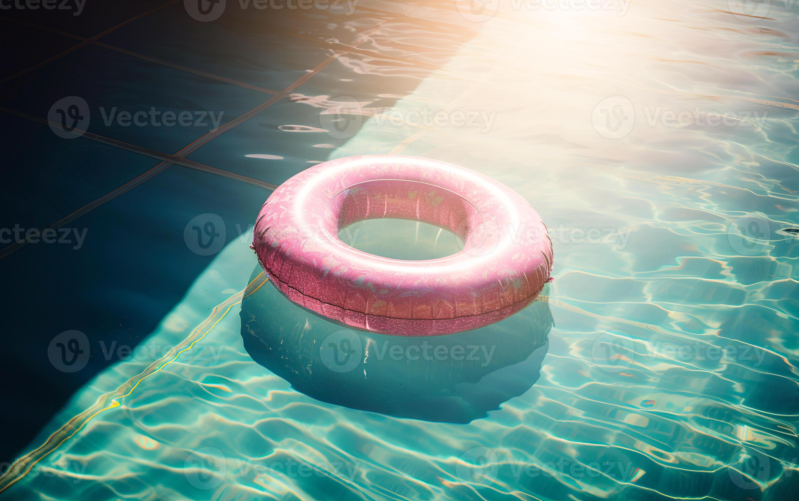 Summer pool with a pink floater and copy space. Travel vacation concept. Summer blue aqua ...