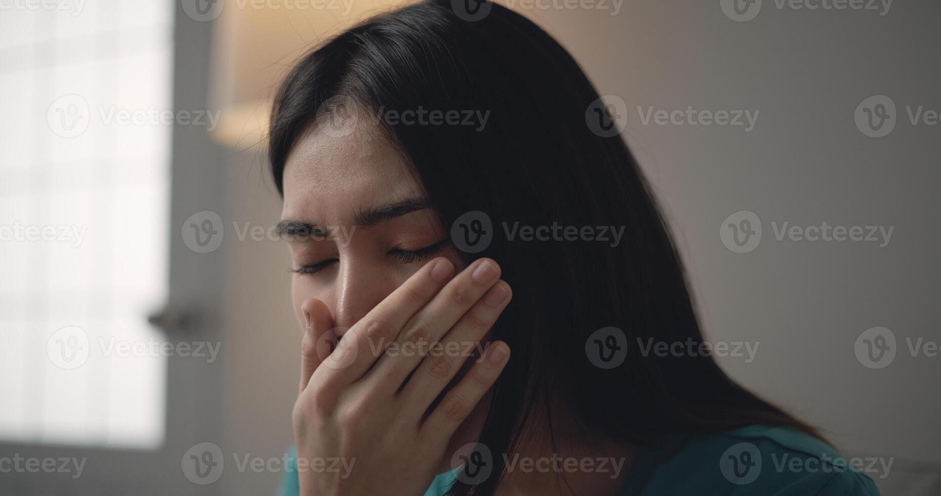 Young Woman Closed Her Eyes And Use Hand Closed Her Mouth While Yawning