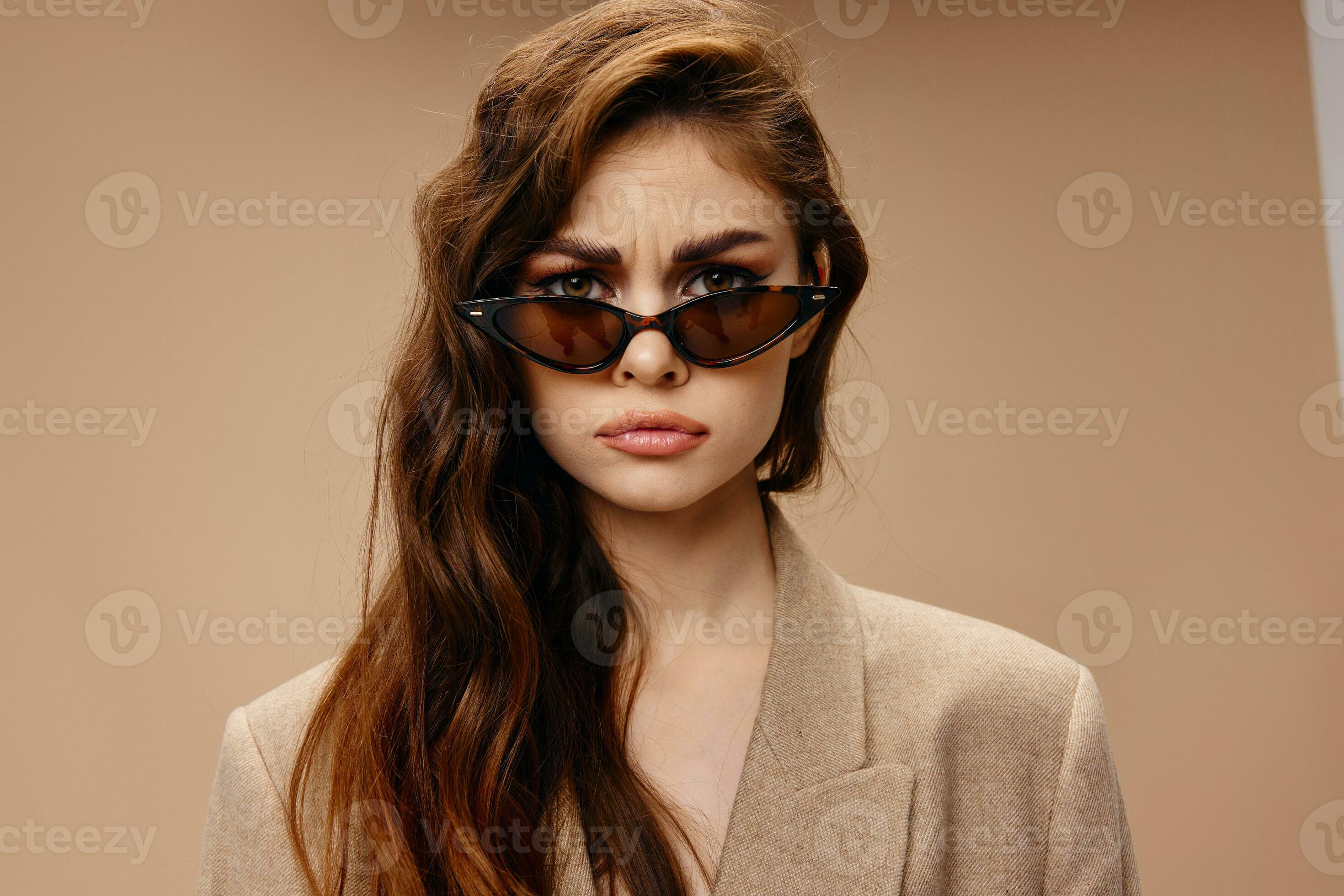 strict woman with glasses and beige coat hairstyle portrait cropped view 23416322 Stock Photo at ...