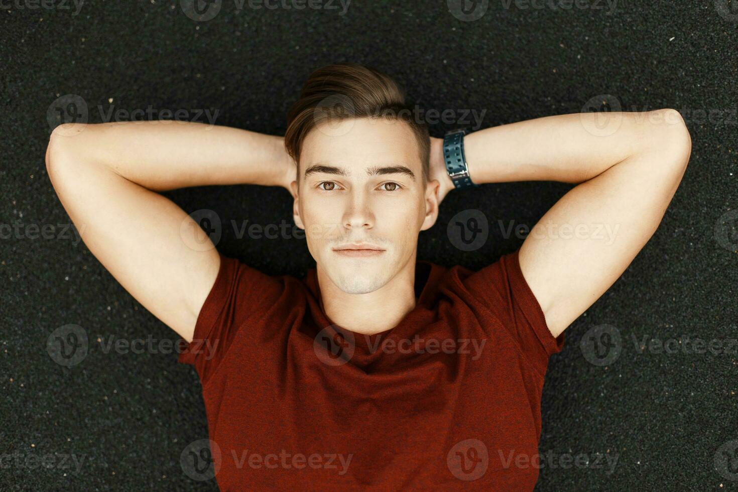 Handsome young man lying down and resting, oudtoors. Man lying on his ... Handsome young man lying down and resting, oudtoors. Man lying on his ...