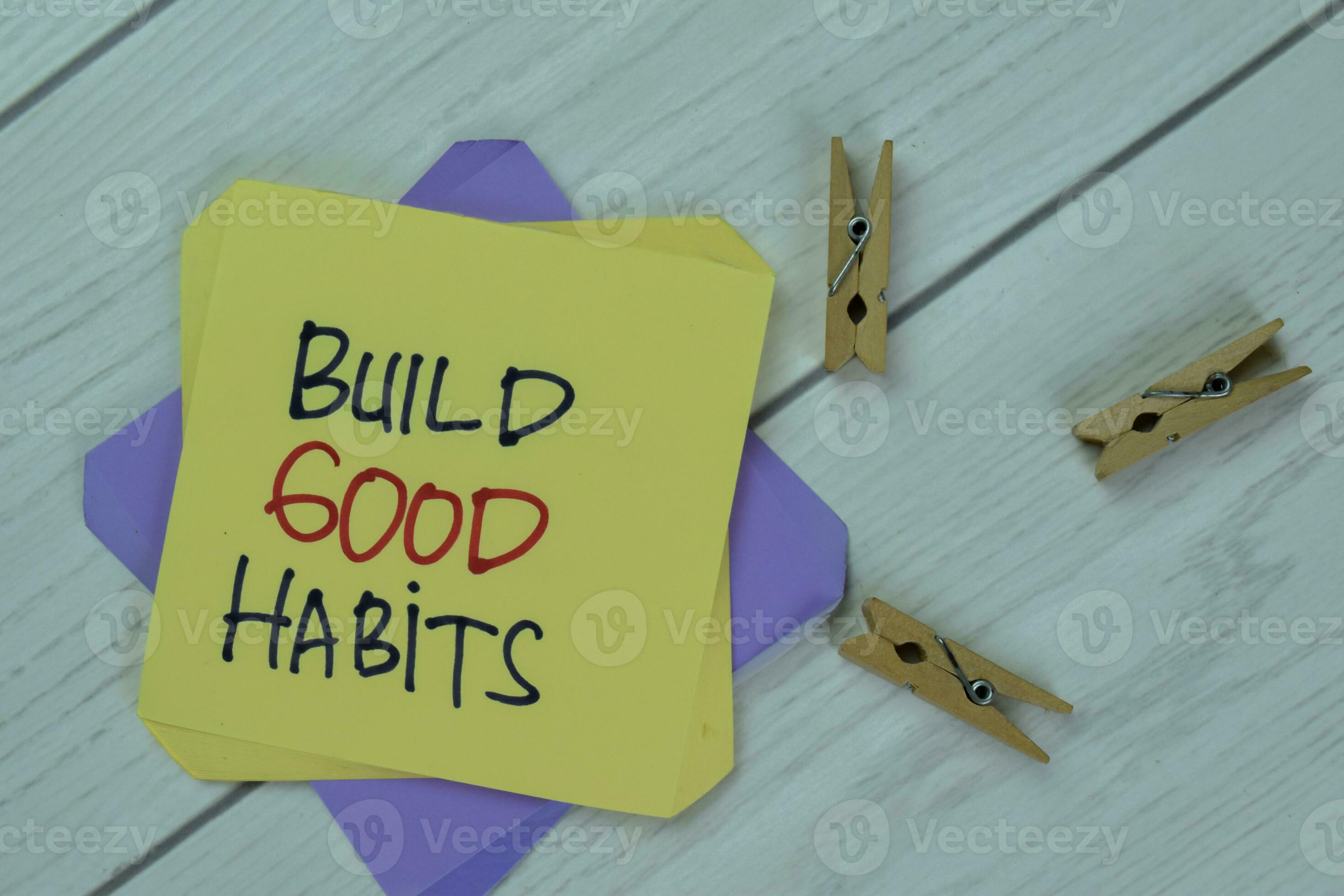 Concept of Build Good Habits write on sticky notes isolated on Wooden ...