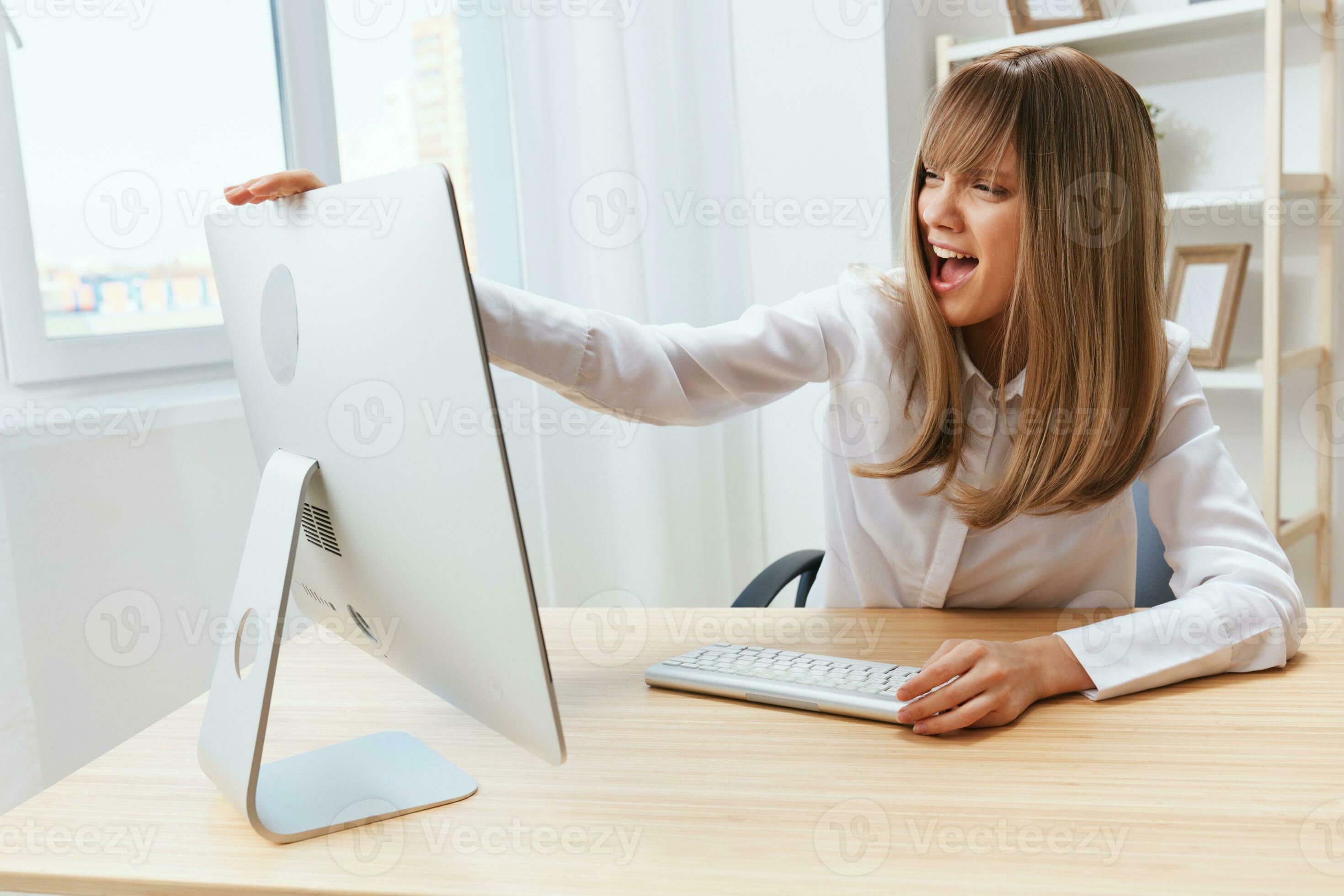 Angry Evil Blonde Businesswoman Screaming To Desktop Raging After