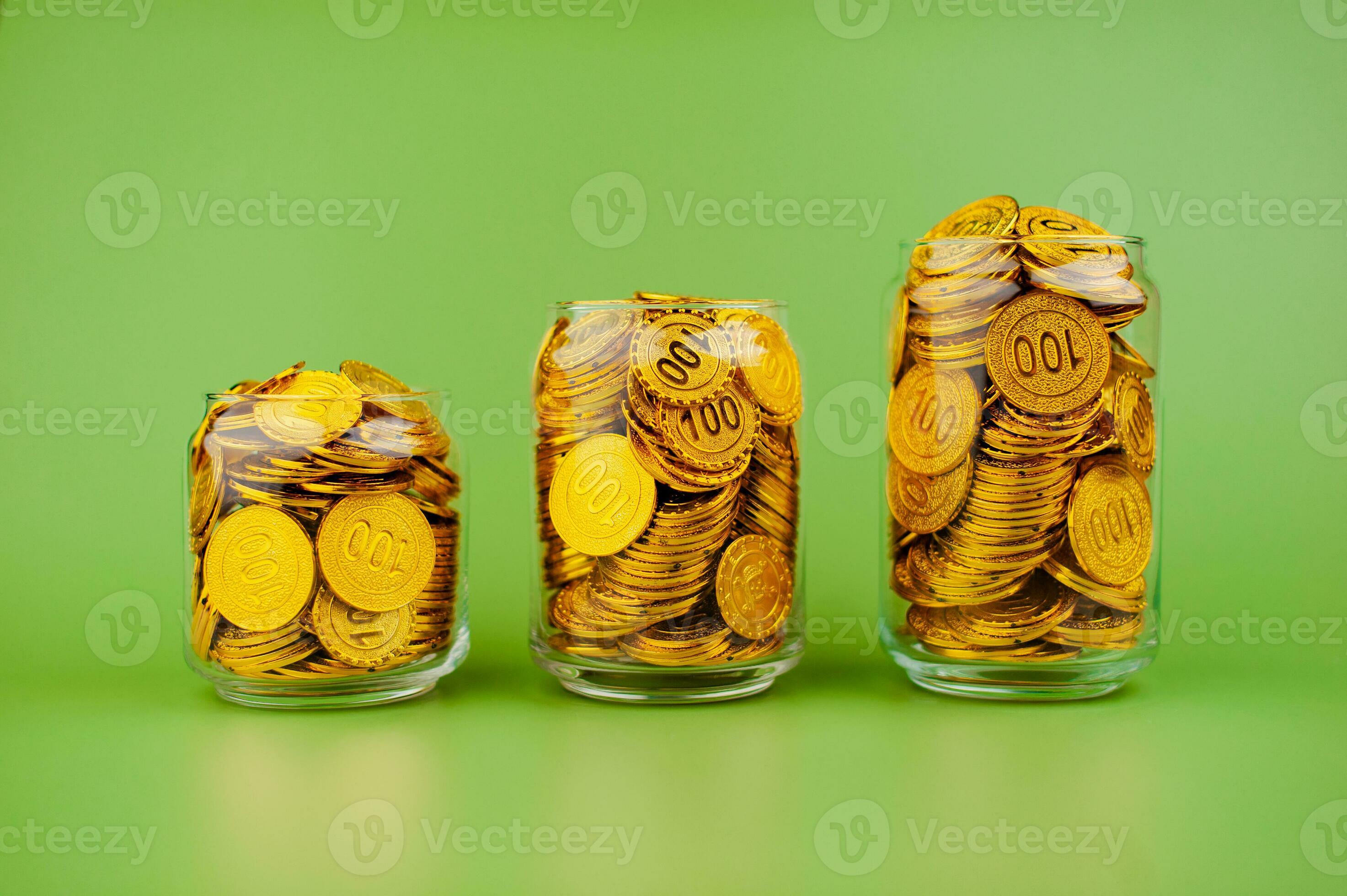 gold coins in a glass jar saving money coin coin bank income wages expenditure money financial ...