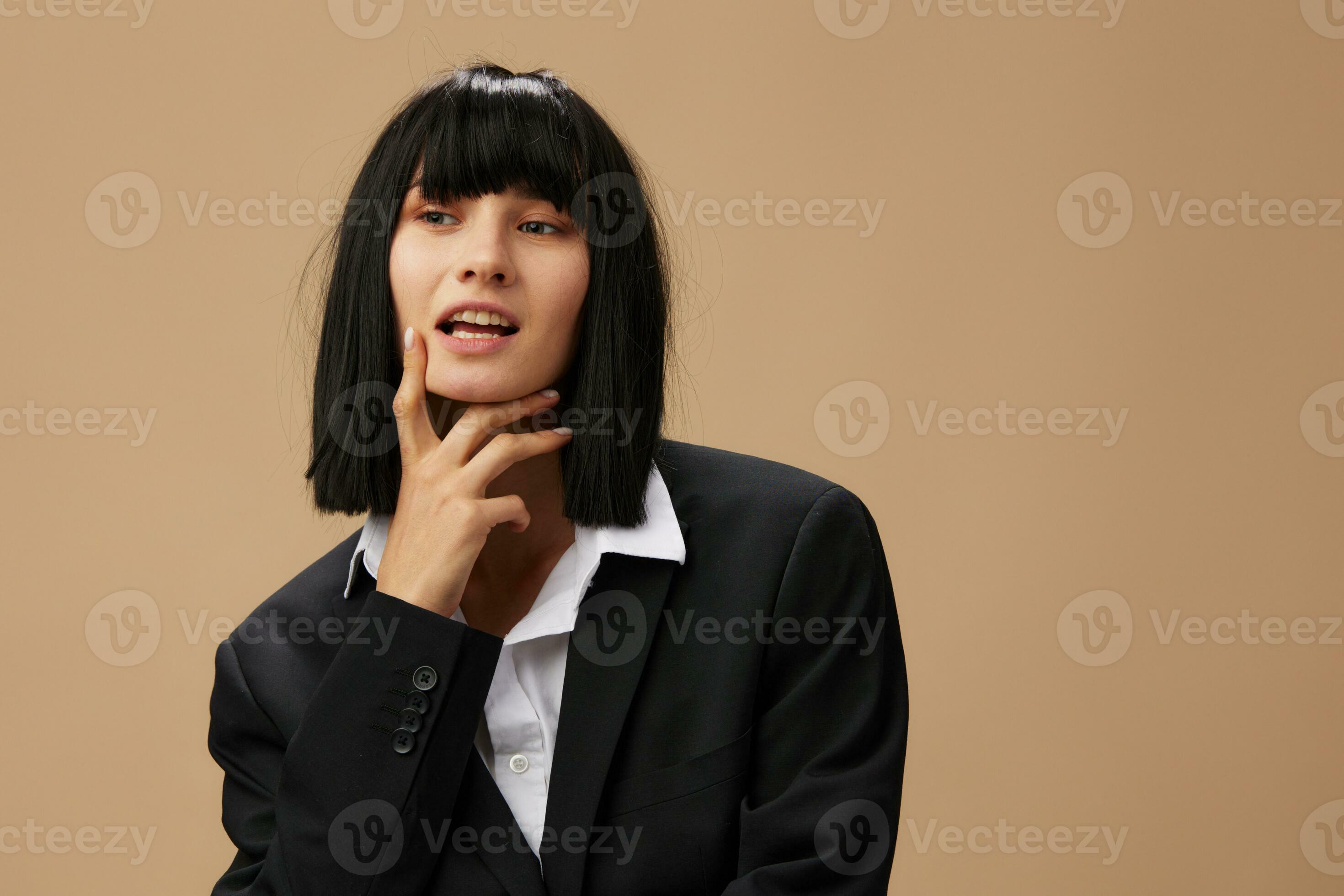 Pensive thoughtful pretty brunet lady in classic suit touch chin open mouth look aside posing ...