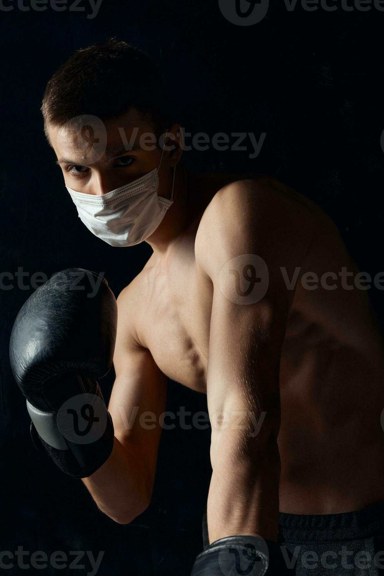 Portrait Of Sportsman Wearing Boxing Gloves And Medical Mask Close Up Cropped View Black