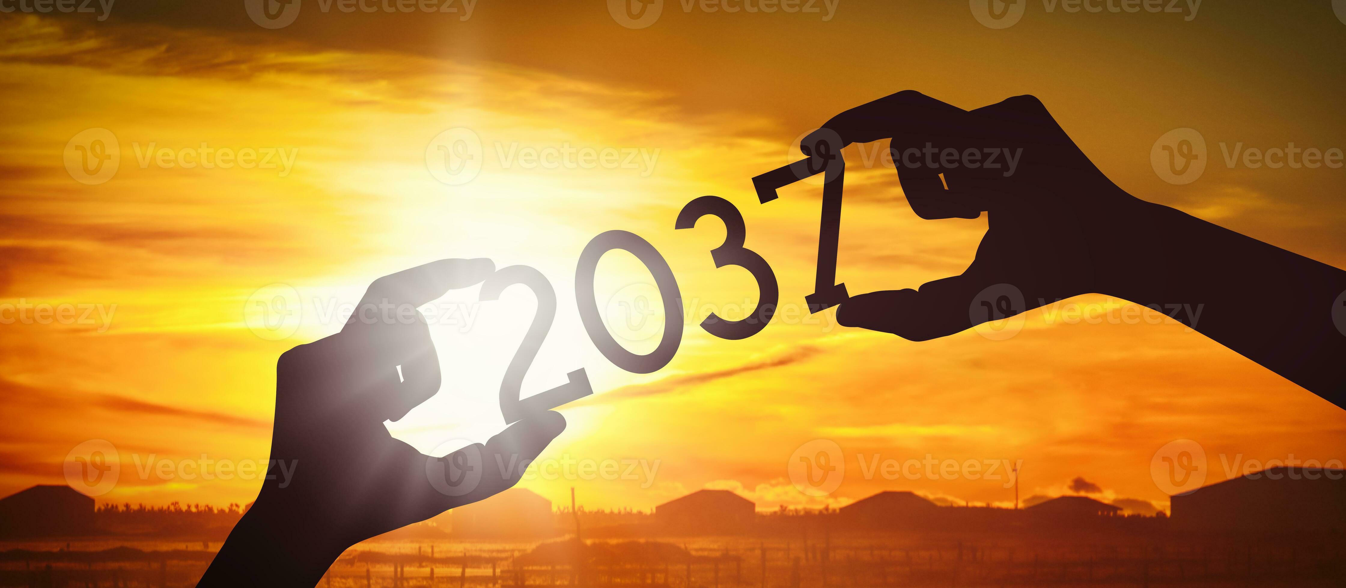 2037 - Human Hands Holding Black Silhouette Year Number 23848034 Stock Photo at Vecteezy