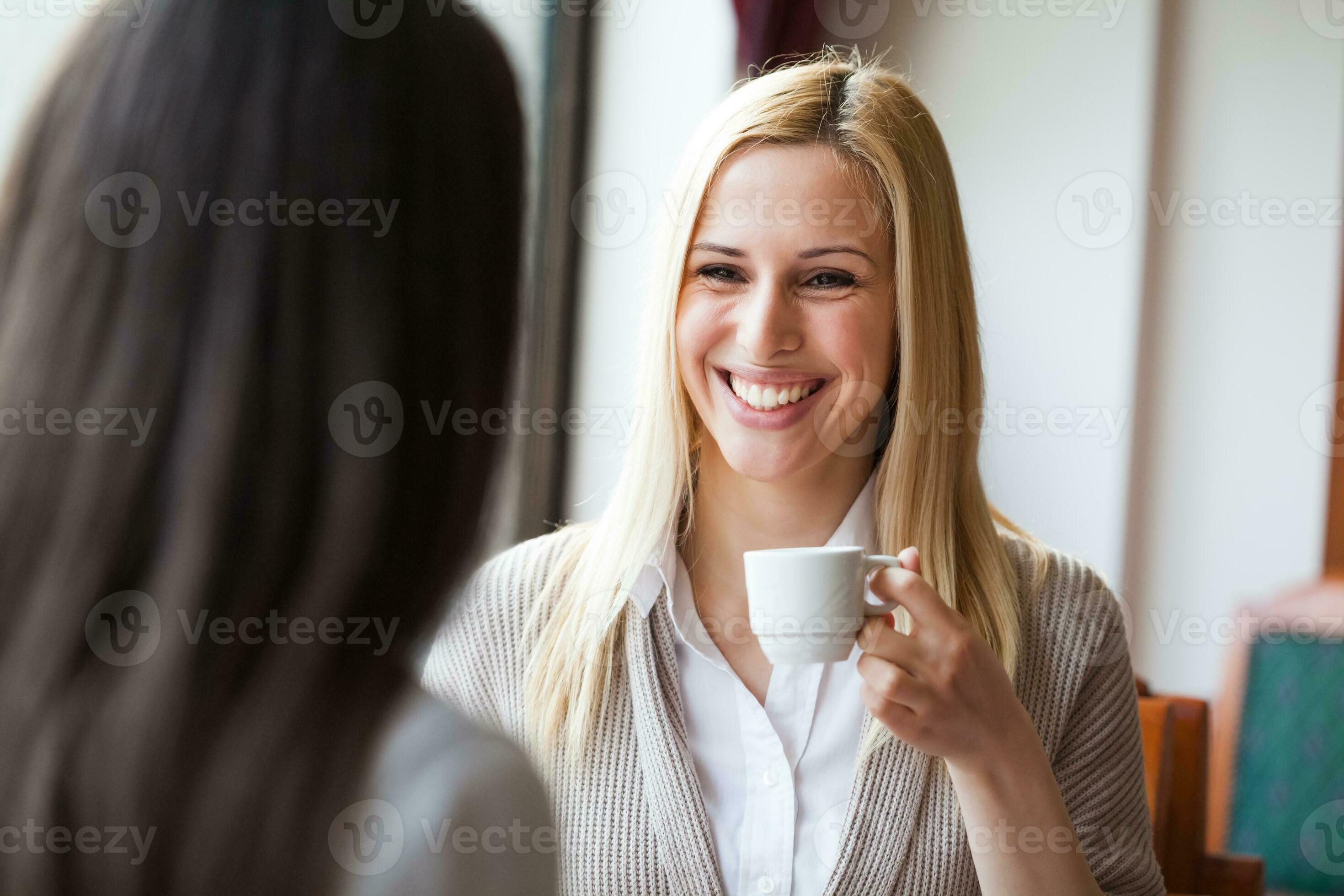 Friends in a cafe 23921403 Stock Photo at Vecteezy
