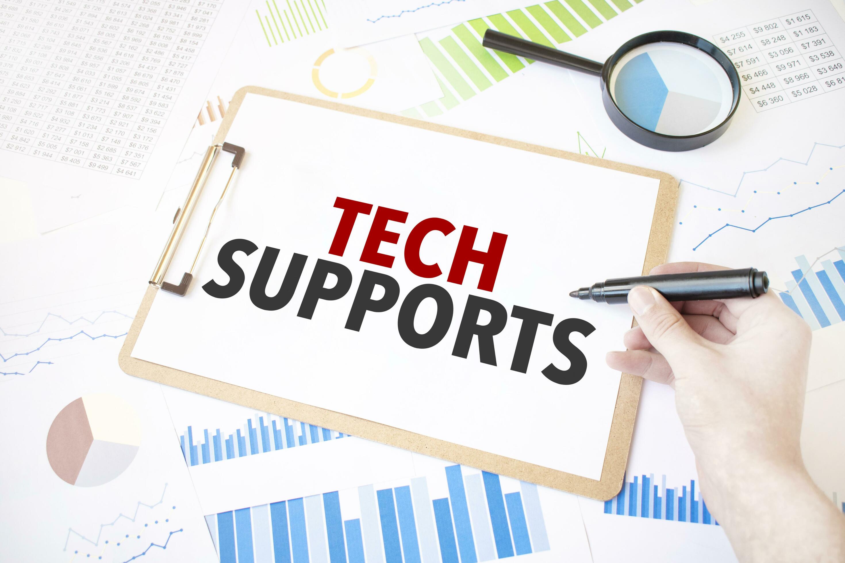 Text tech supports on white paper sheet and marker on businessman hand on the diagram. Business ...