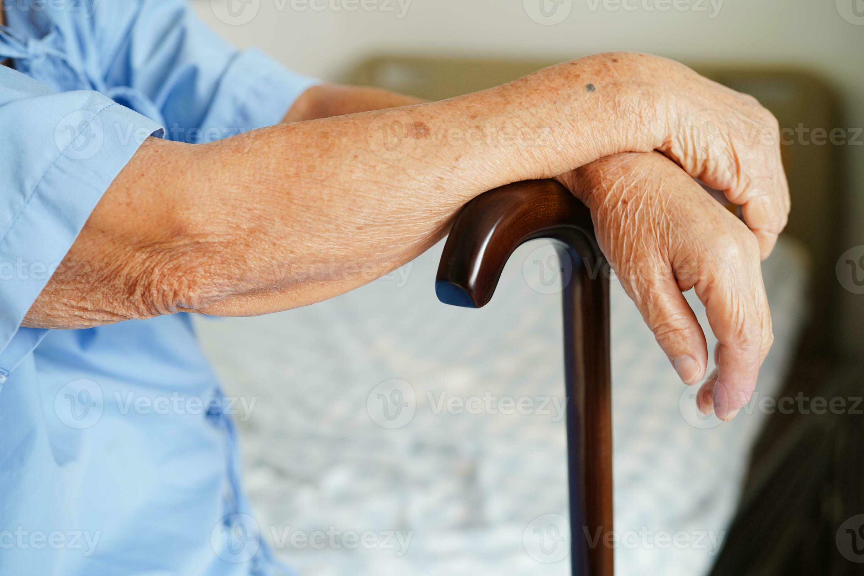 Asian Elderly Disability Woman Patient Holding Walking Stick In