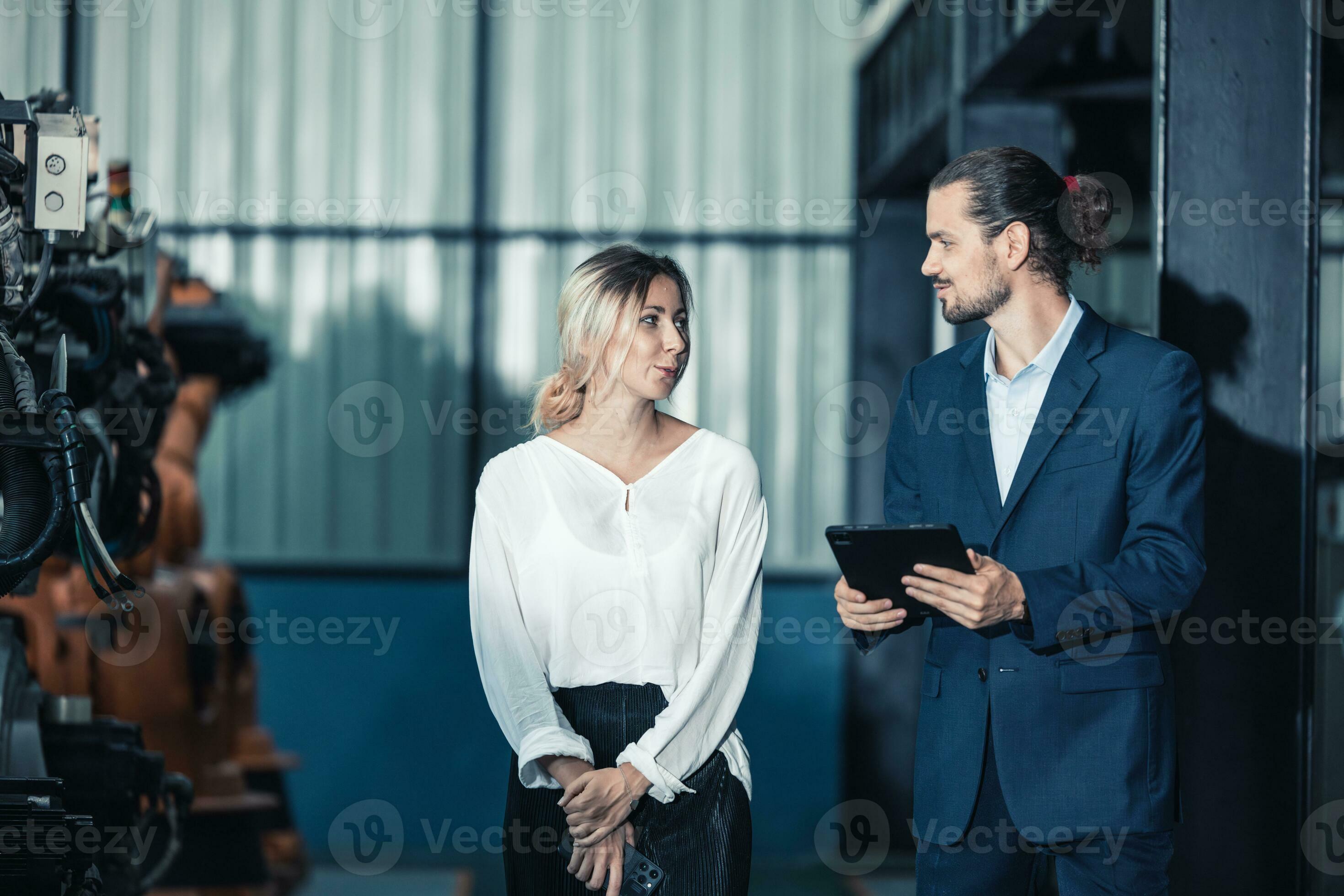 Robotic factory owner explain, discuss functionality and performance of robot systems with ...