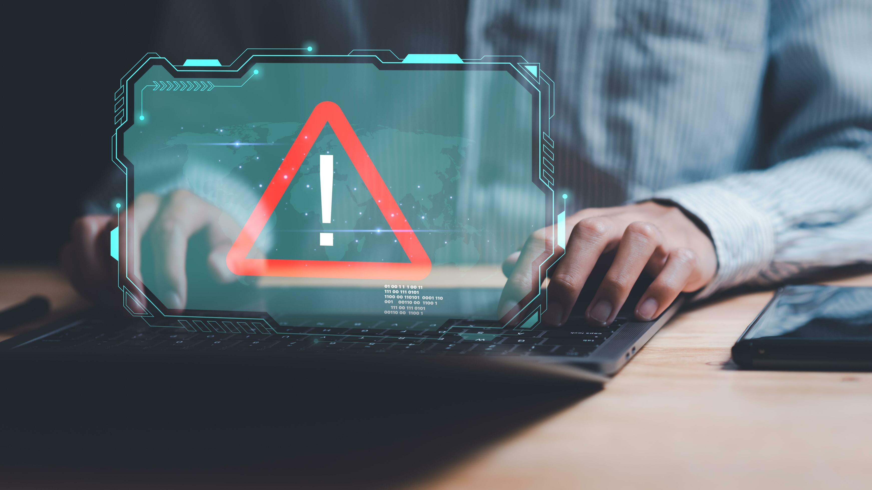 Programmer and virtual icons, exclamation mark ,alarm,computer virus ...