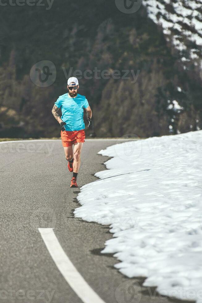 Male runner uphill on alpine pass road 24201645 Stock Photo at Vecteezy Male runner uphill on alpine pass road 24201645 Stock Photo at Vecteezy