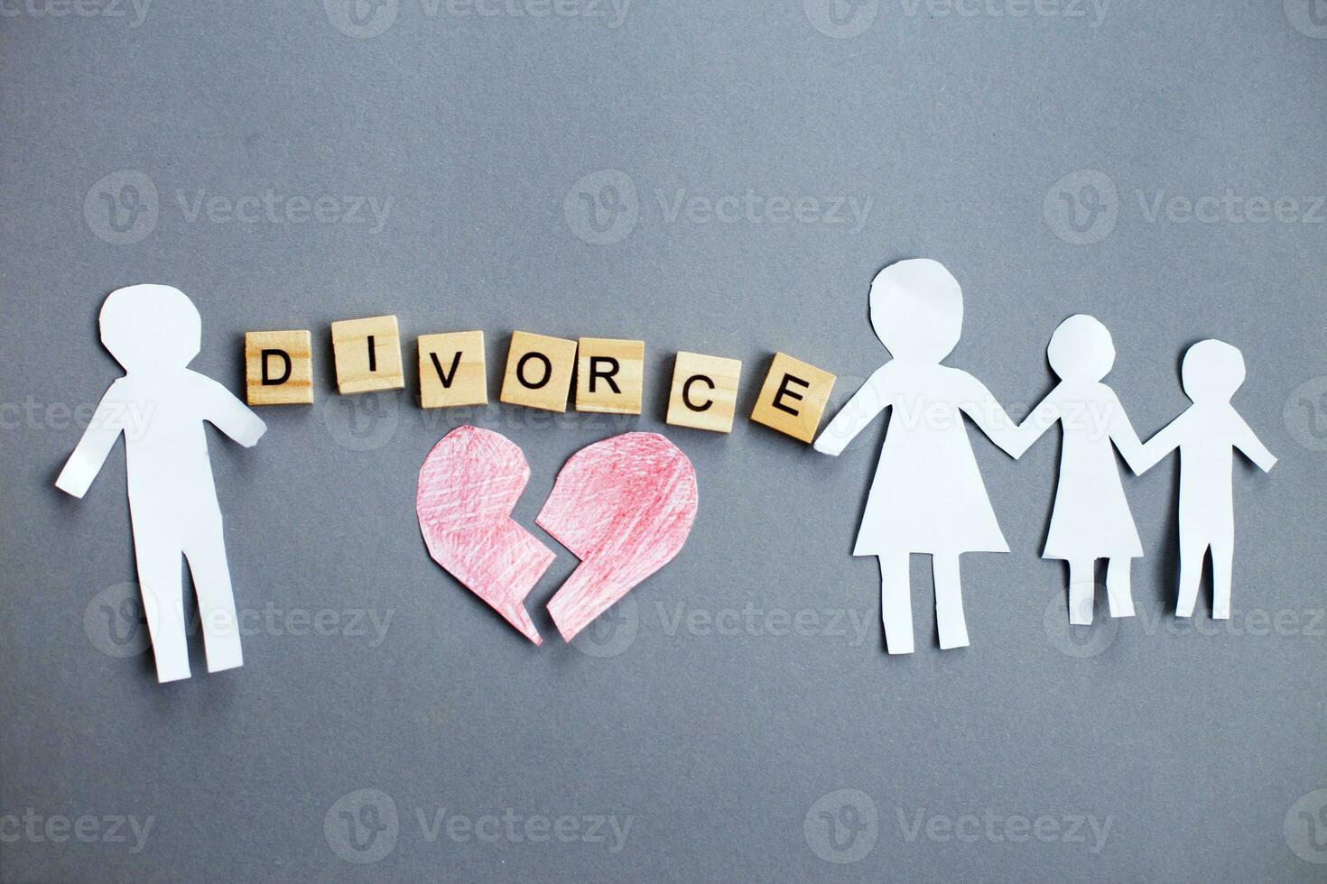 Paper chain cut family with broken heart on gray background. Divorce ... Paper chain cut family with broken heart on gray background. Divorce ...