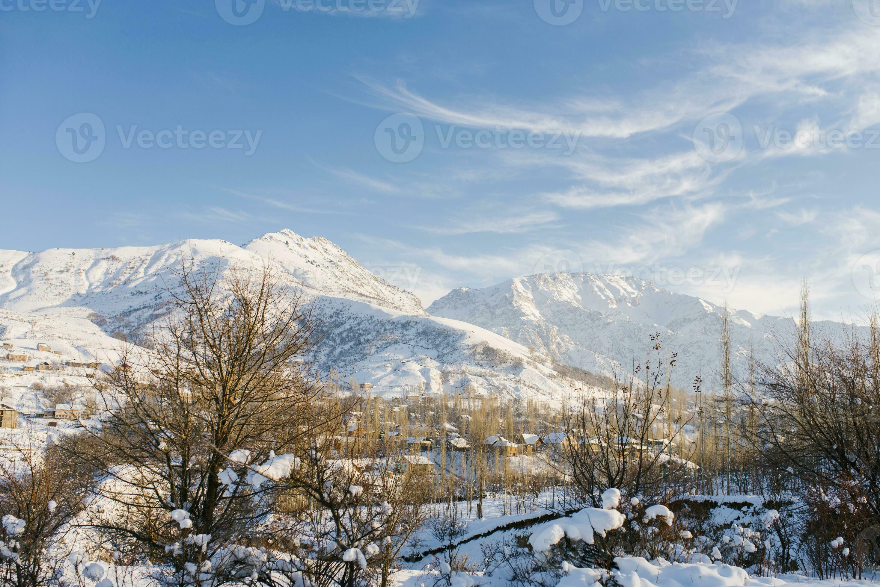 Beautiful mountain landscape in winter in Uzbekistan in the area of mount Chimgan. Cirrus clouds ...