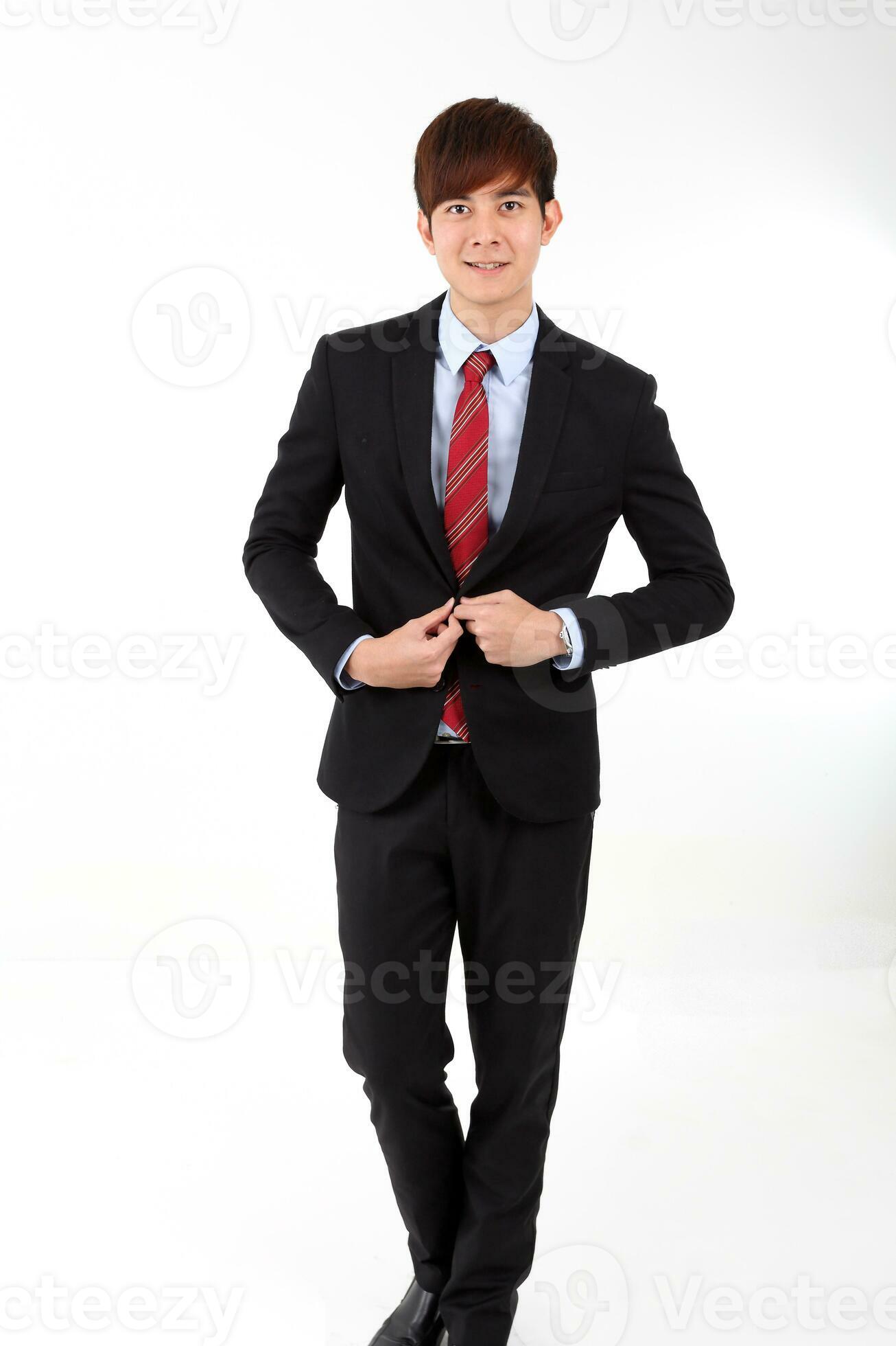 Young mart handsome Asian man business office wearing suit tie on white background walk forward ...
